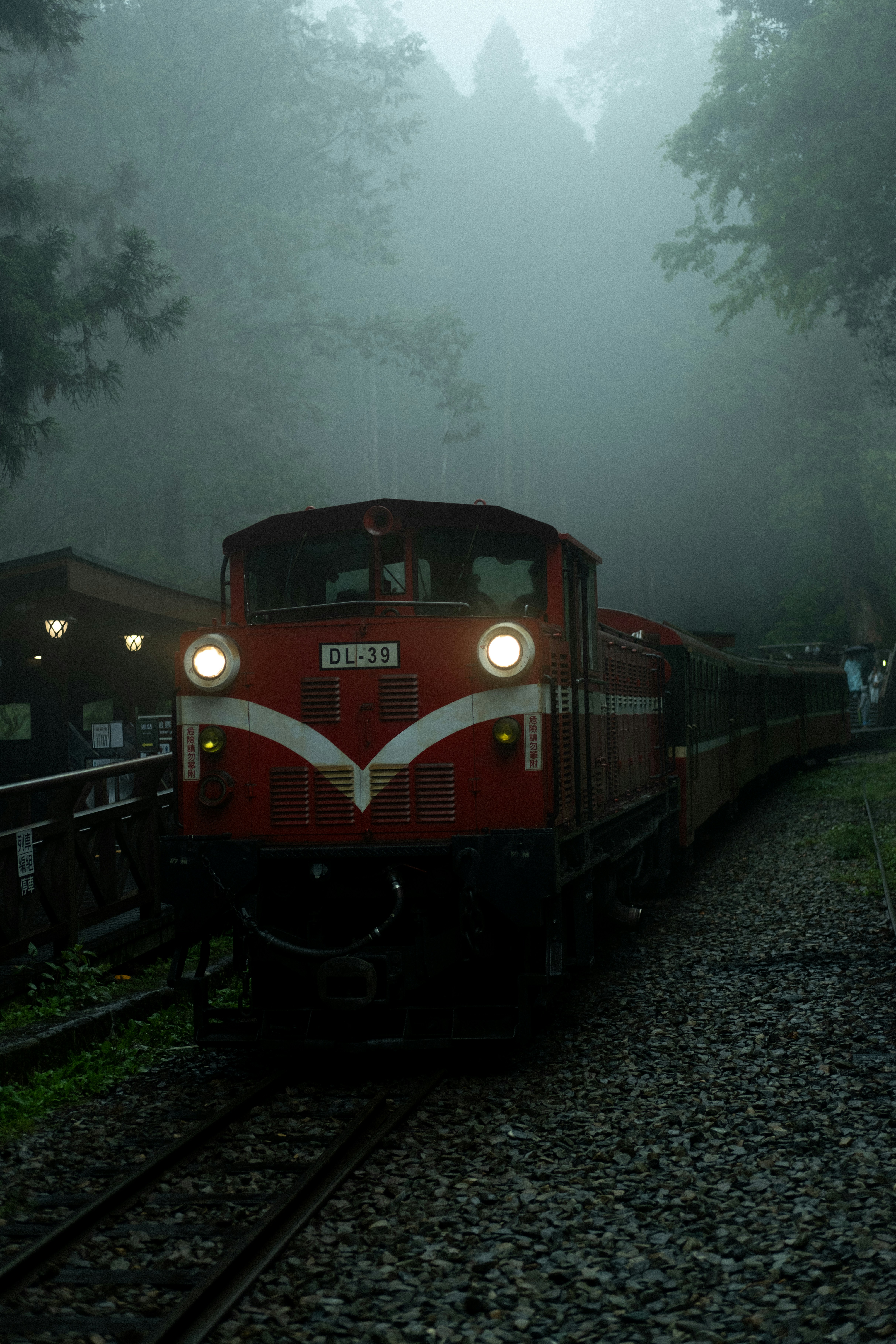 Red Locomotive Emerging from the Mist