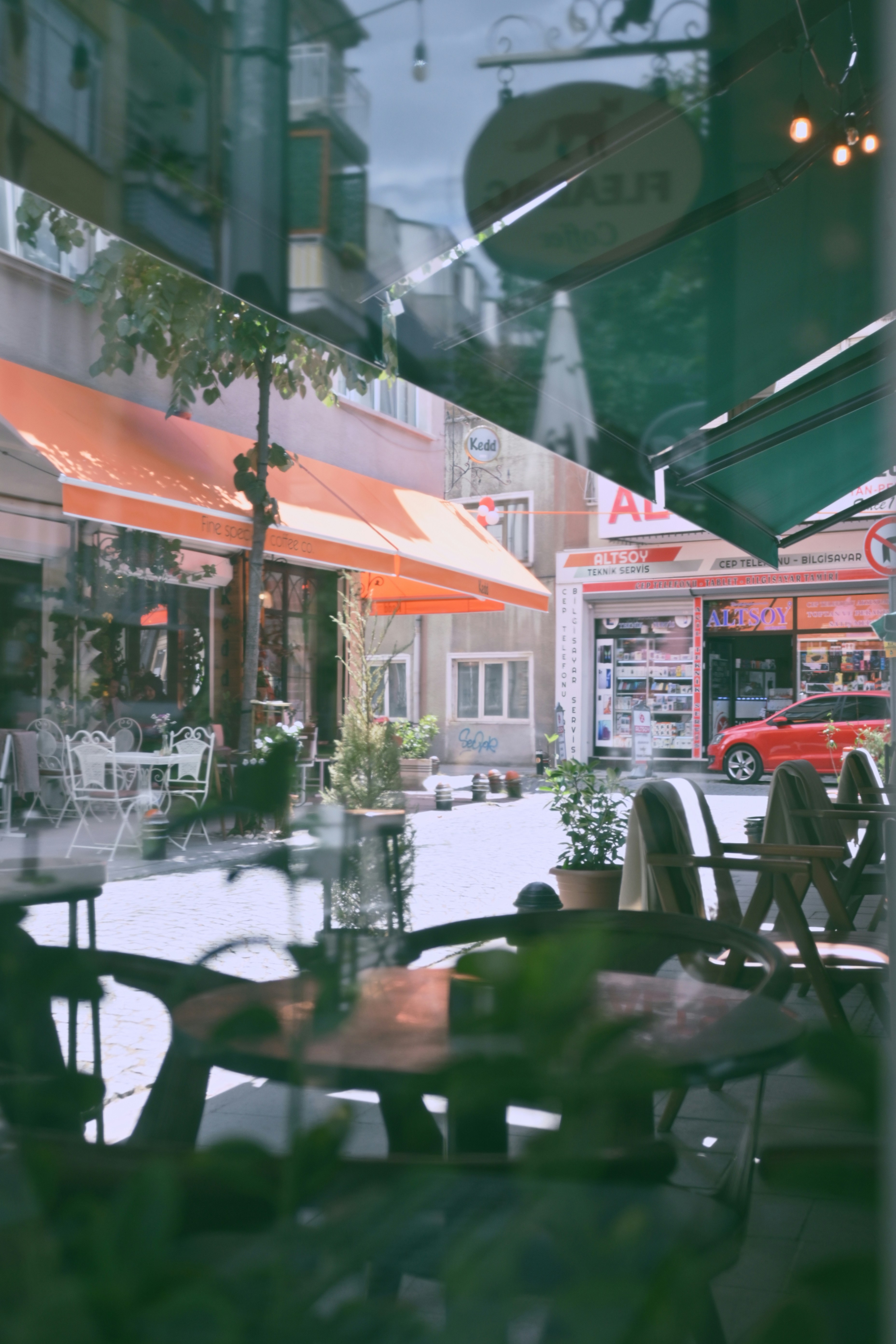 Glass Reflections Over a Cozy Street Café