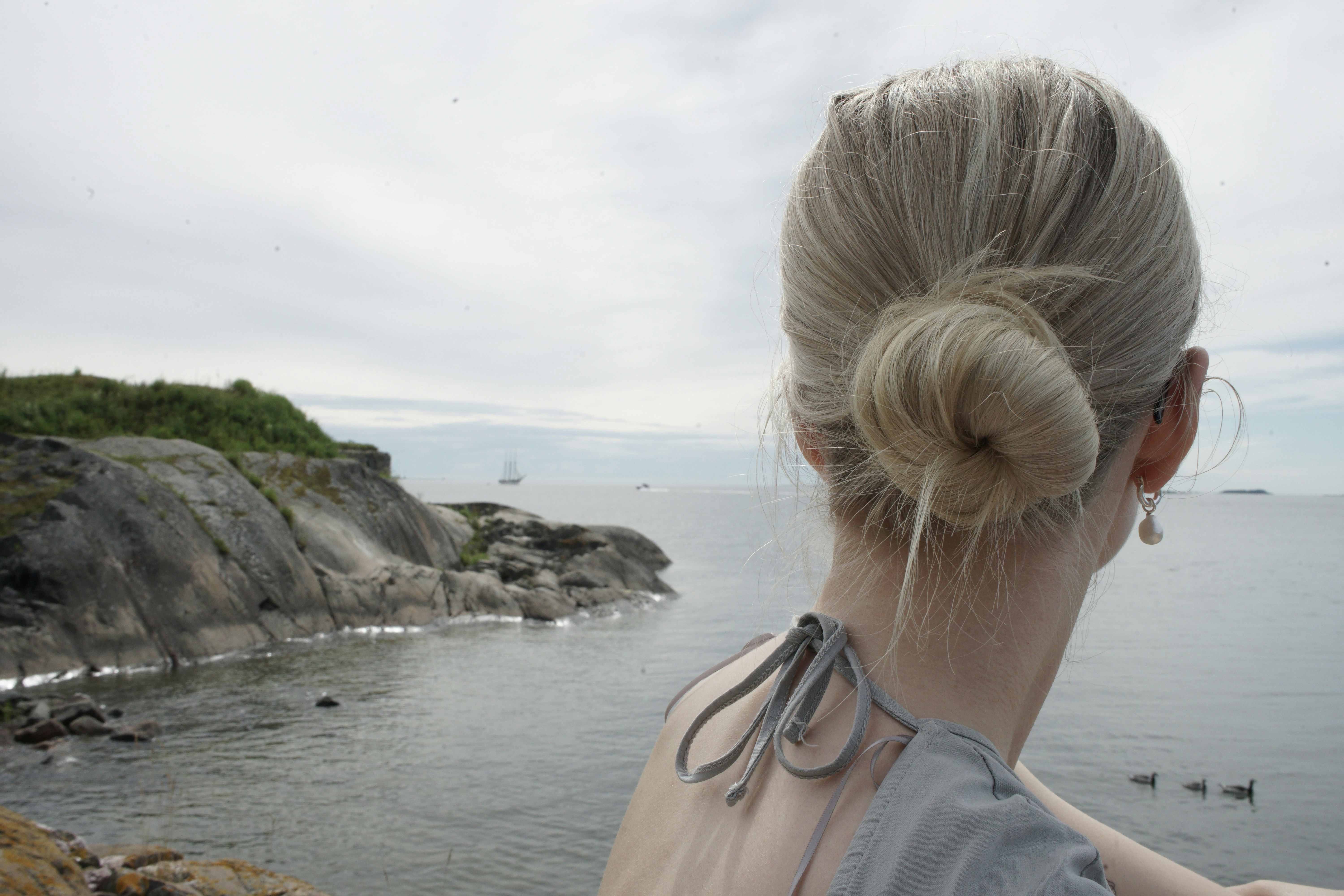 Backed by the Sea: a Quiet Portrait with a Wind-Sculpted Tie