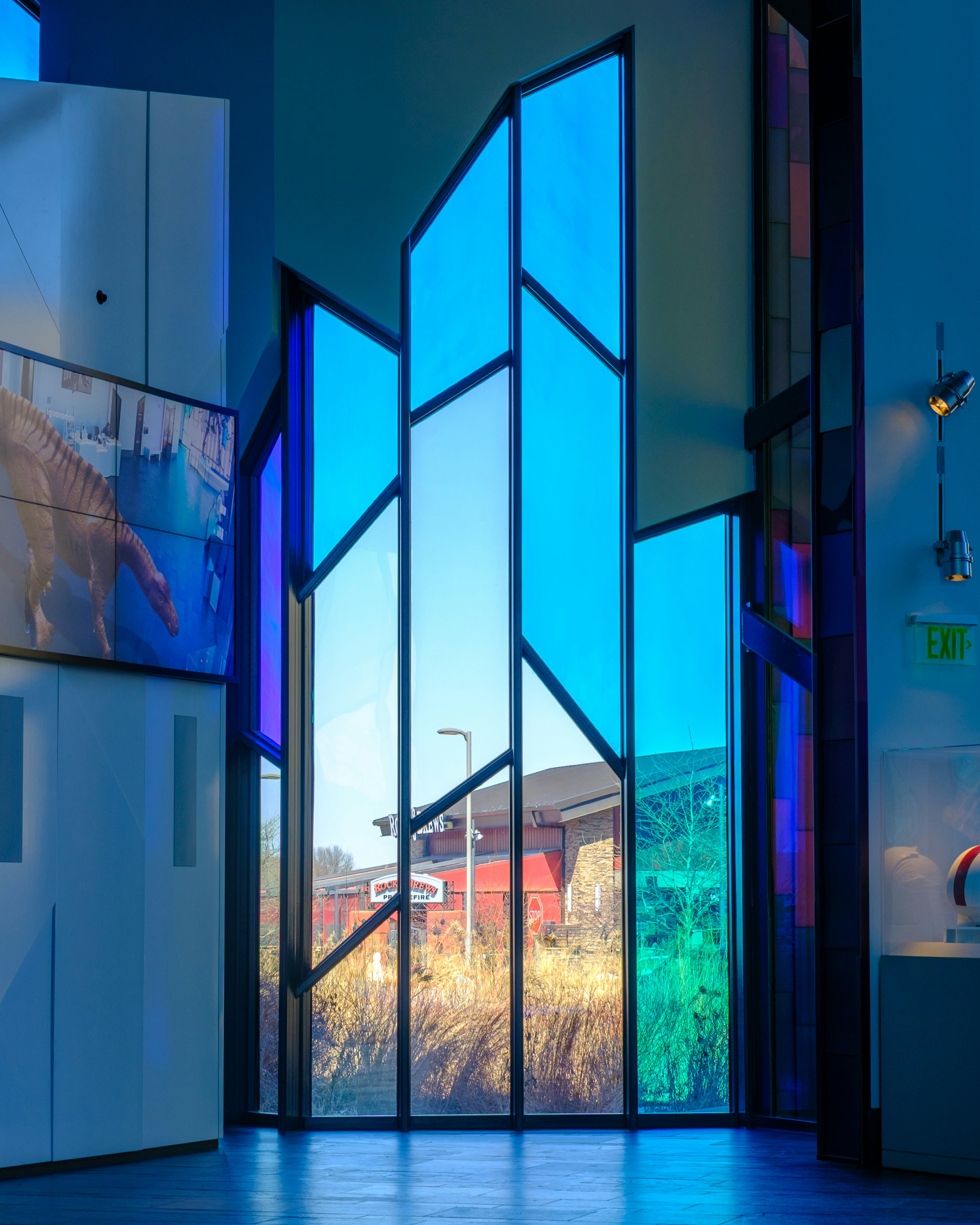 Chromatic Cathedral: Afternoon Light Illuminates Modern Glass Facade