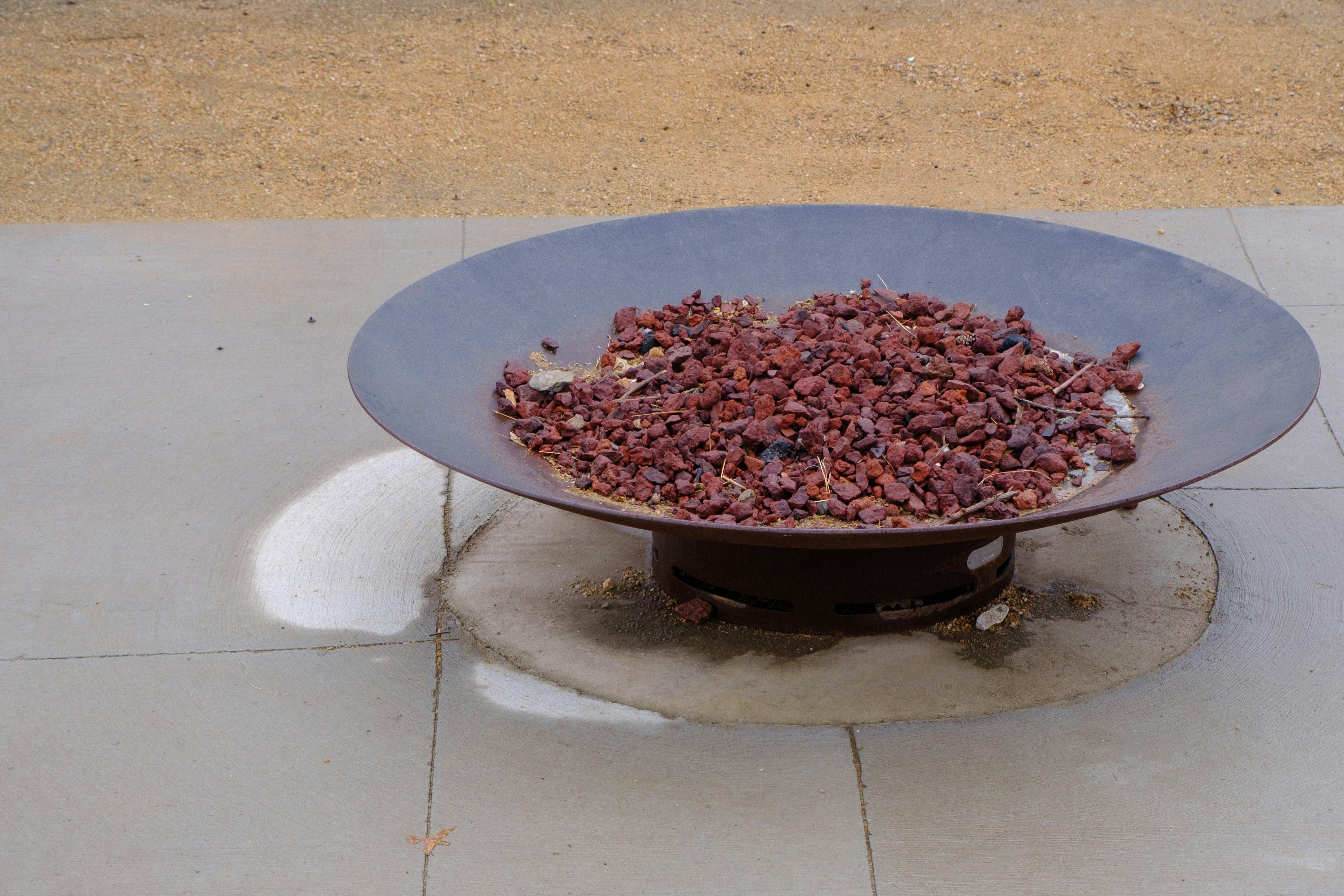 Coal-Red Ember Bowl on a Concrete Stage
