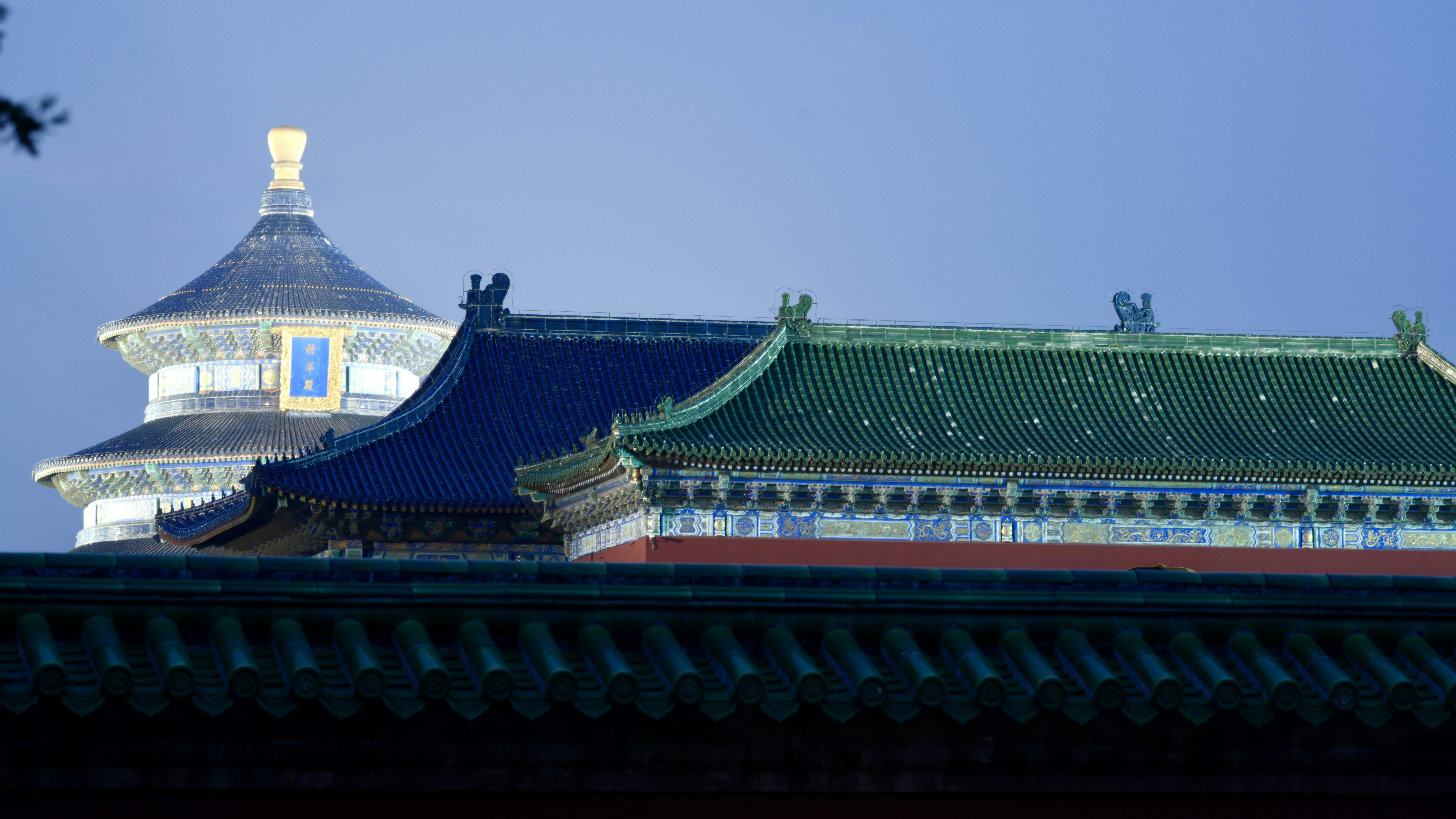 Temple Rooflines at Dusk: A Quiet Courtyard under Cerulean Sky