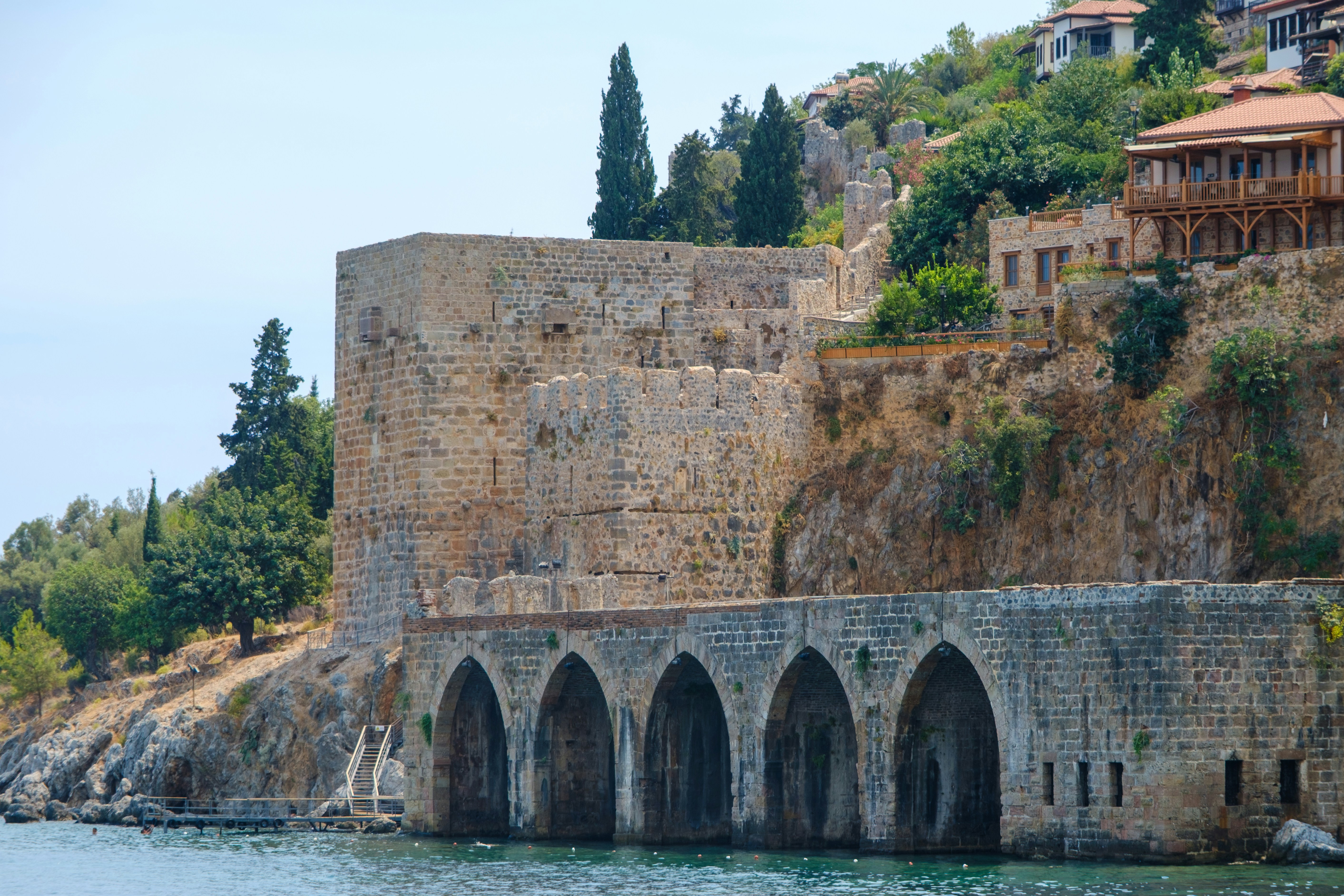 Stone Shoreline Fortress: Arches Meeting the Sea