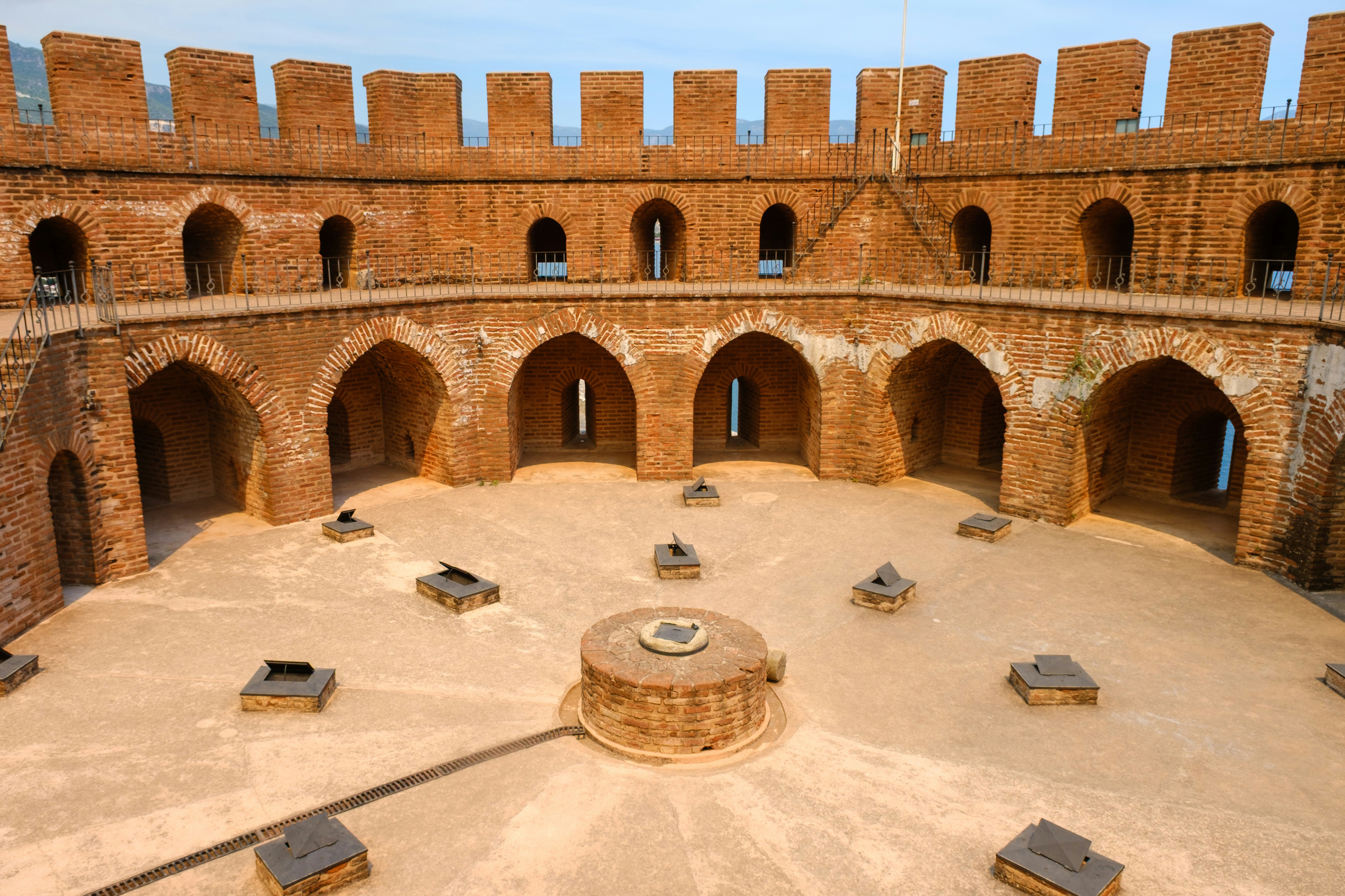 Circular Courtyard of a Red Brick Fort with Central Well