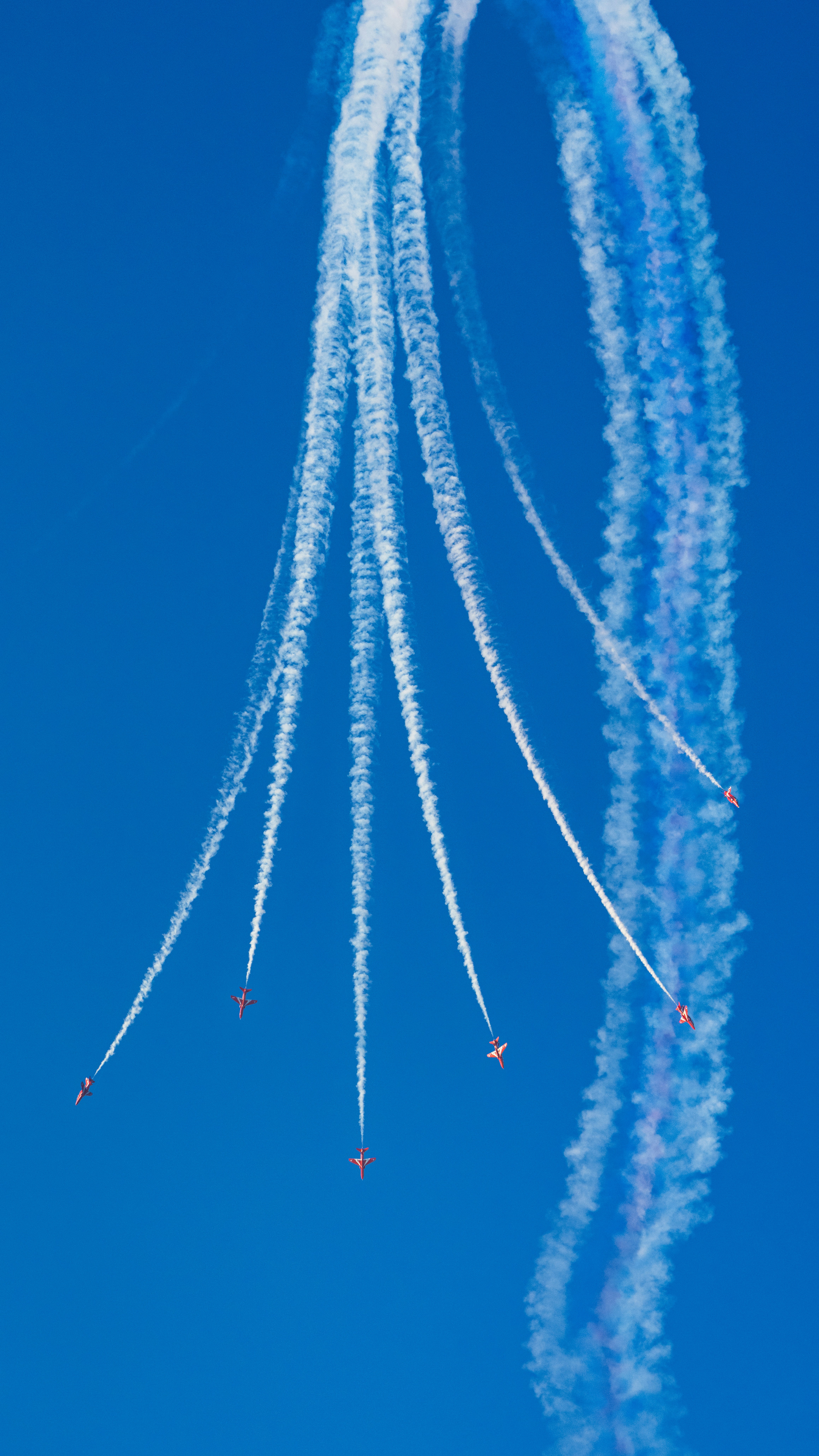 Tangled Contrails: A Wisp of Fire and Smoke in a Clear Sky