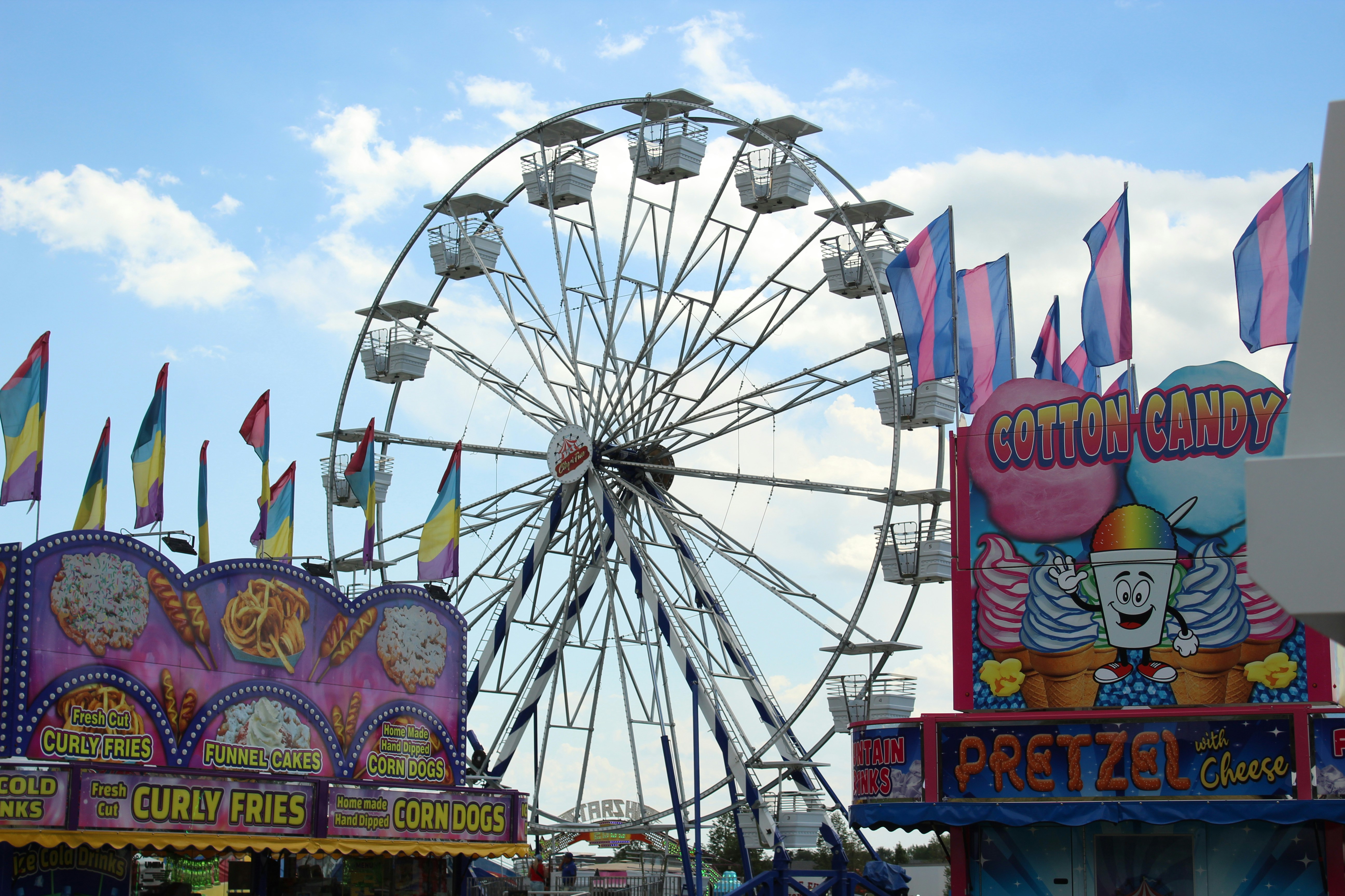 Ferris Wheel Over a Colorful Carnival Arcade