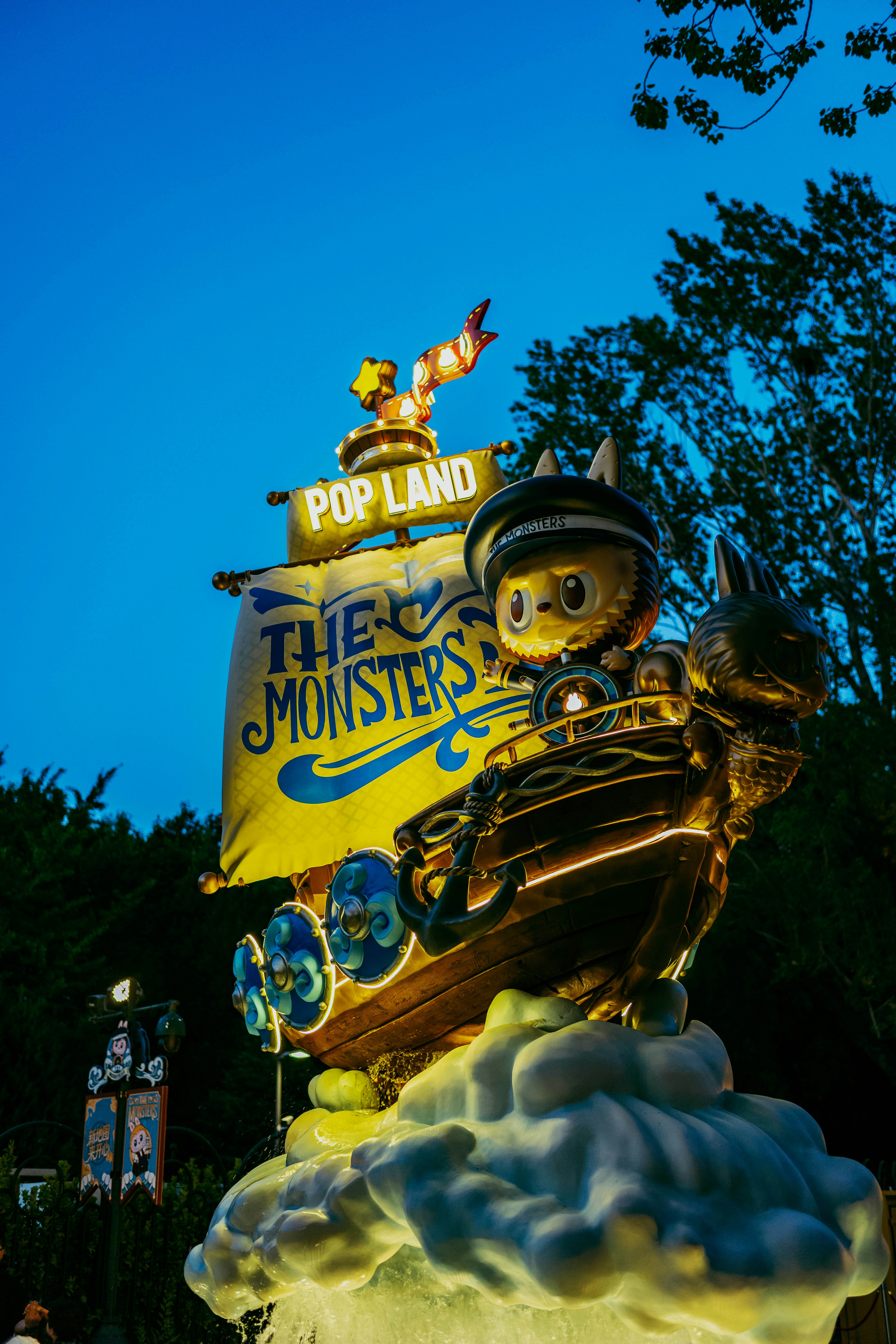 The Monstrous Parade: Neon Ship Cresting Over Cloudy Folklore