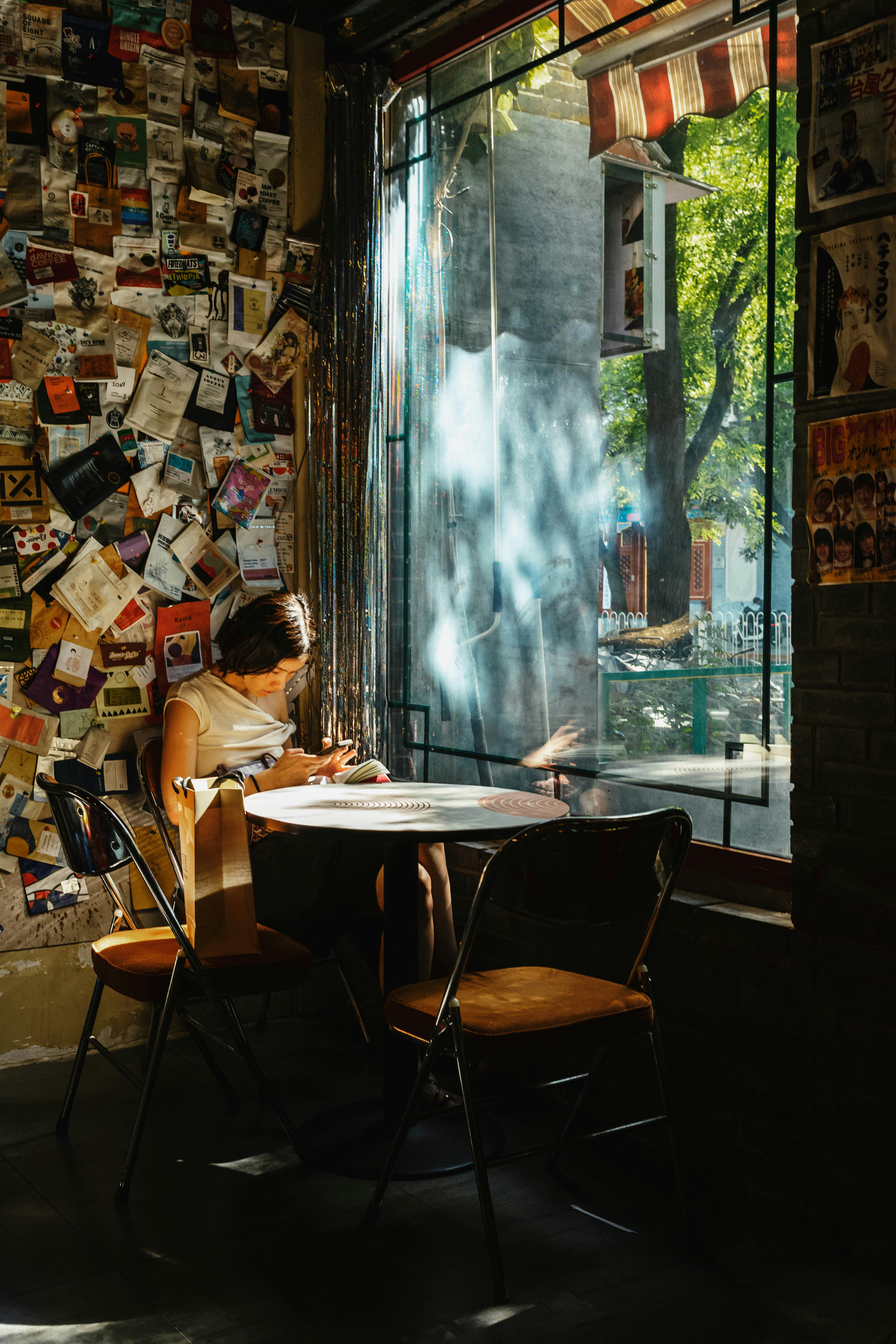 Quiet Corner: A Girl in Soft Light at a Wall of Cards