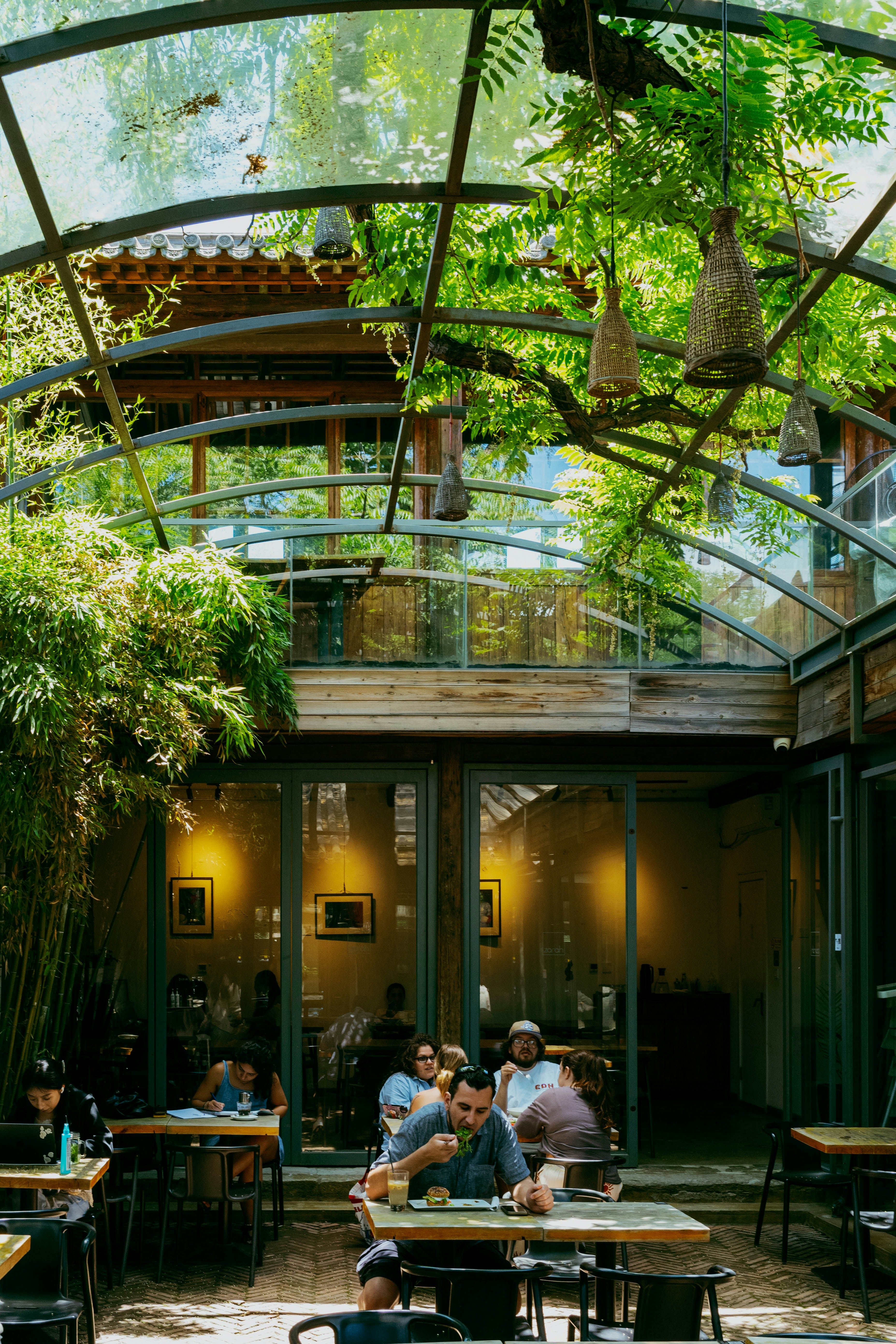 Courtyard Café Beneath a Glass Arch
