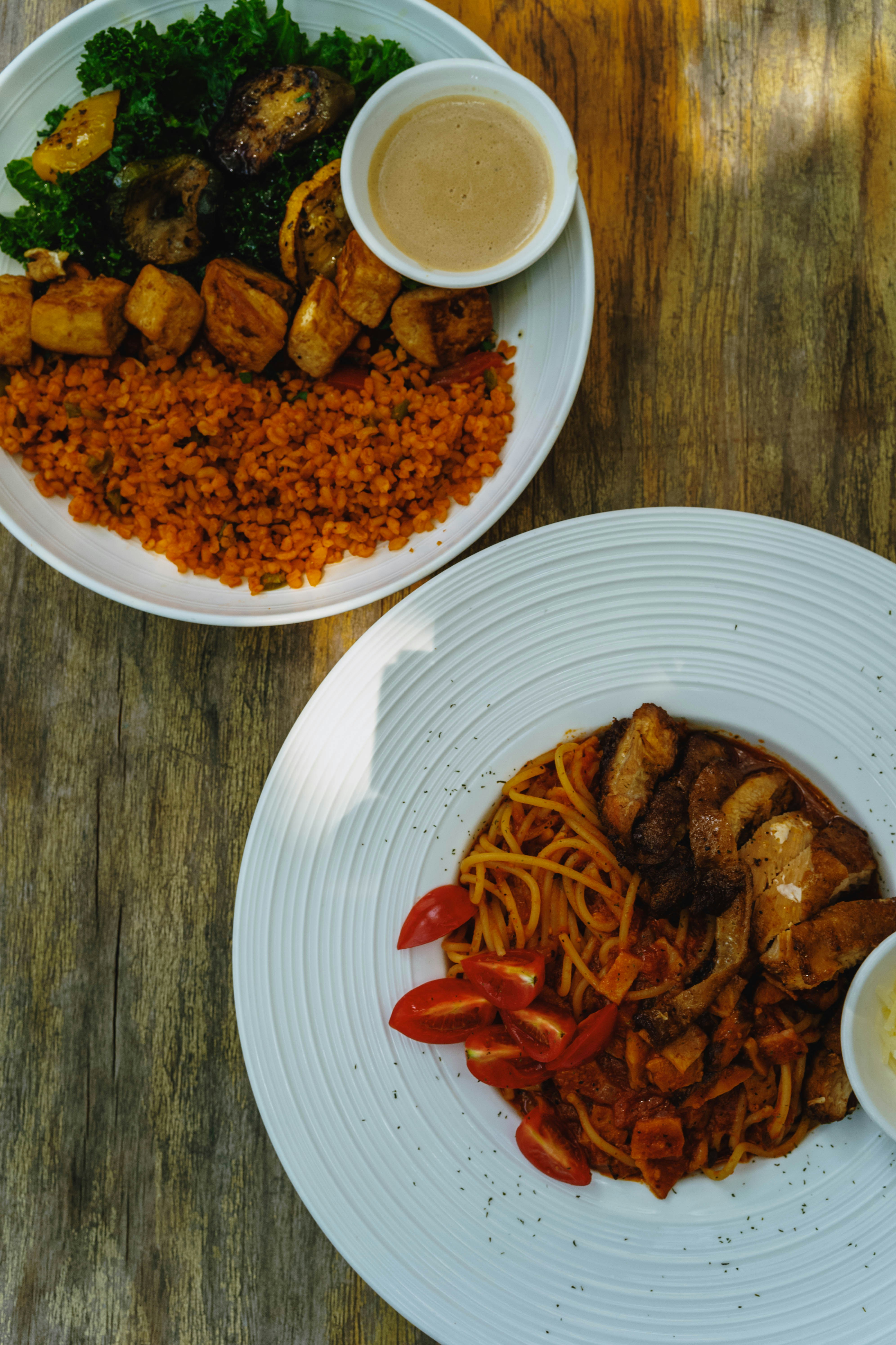 Dual Plates, Two Journeys: Mediterranean Comfort on a Wooden Table