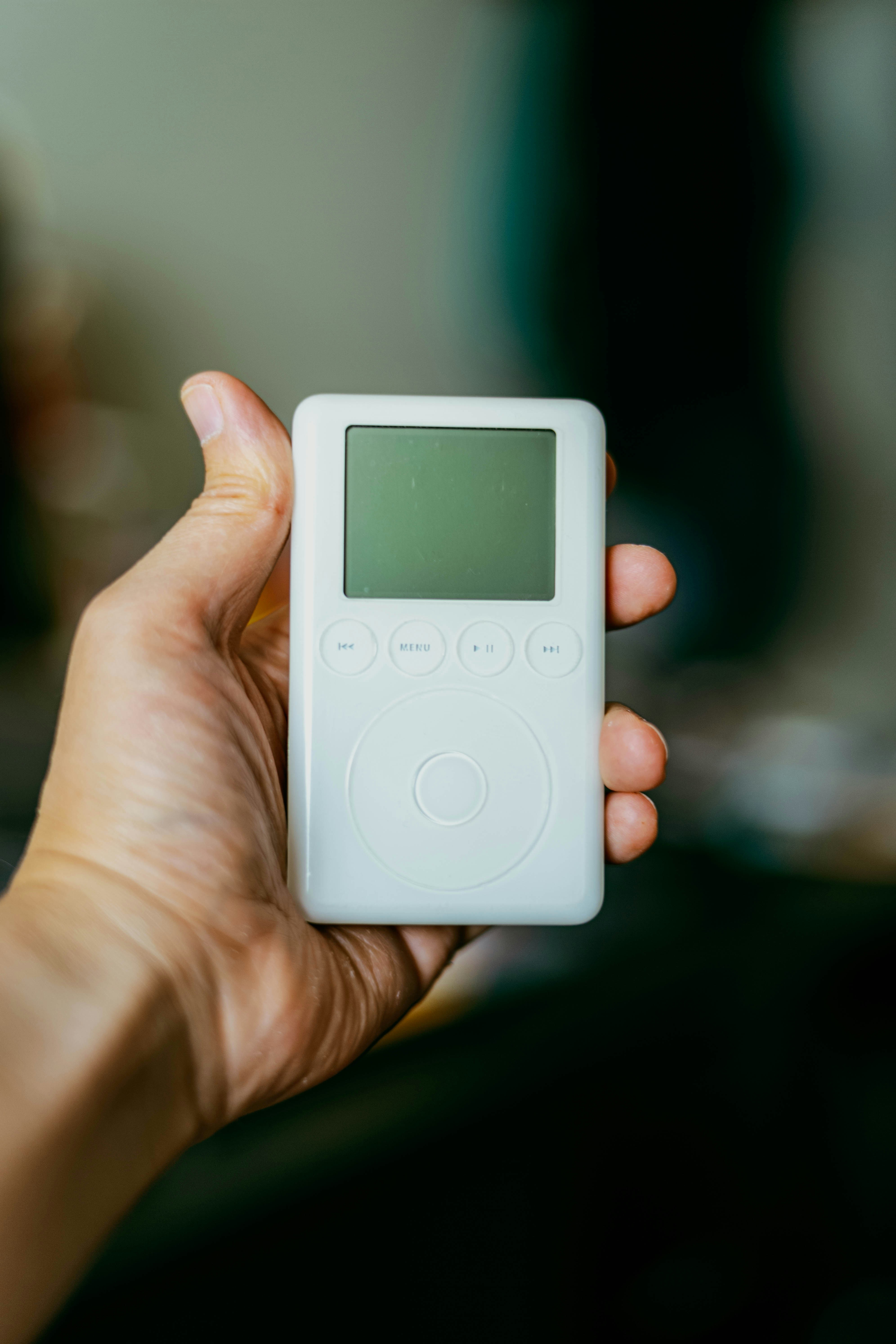 Tiny White Remote: A Handful of Calm in a Soft-Focused Scene