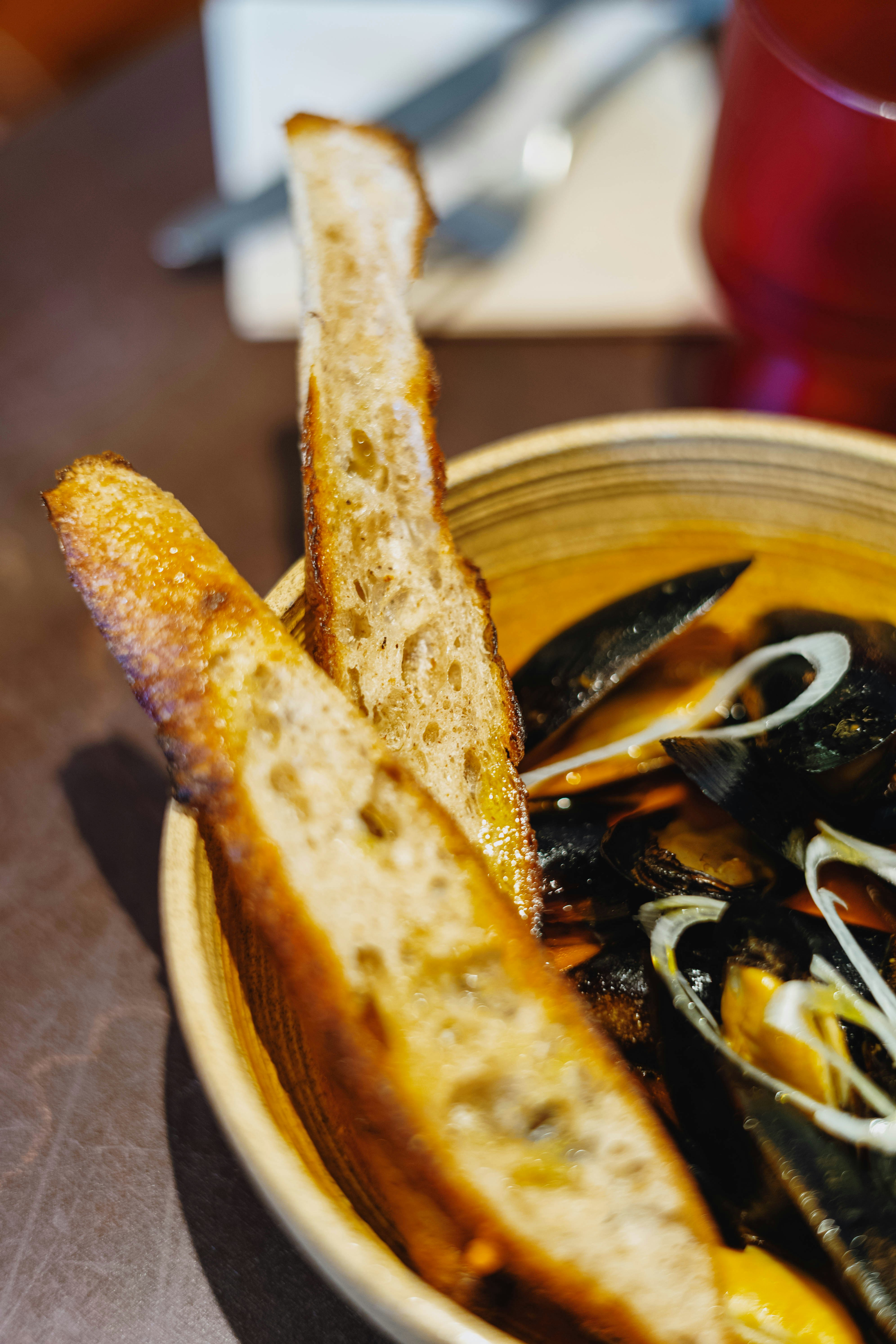 Crusty Baguette Tango Over a Bowl of Mussels