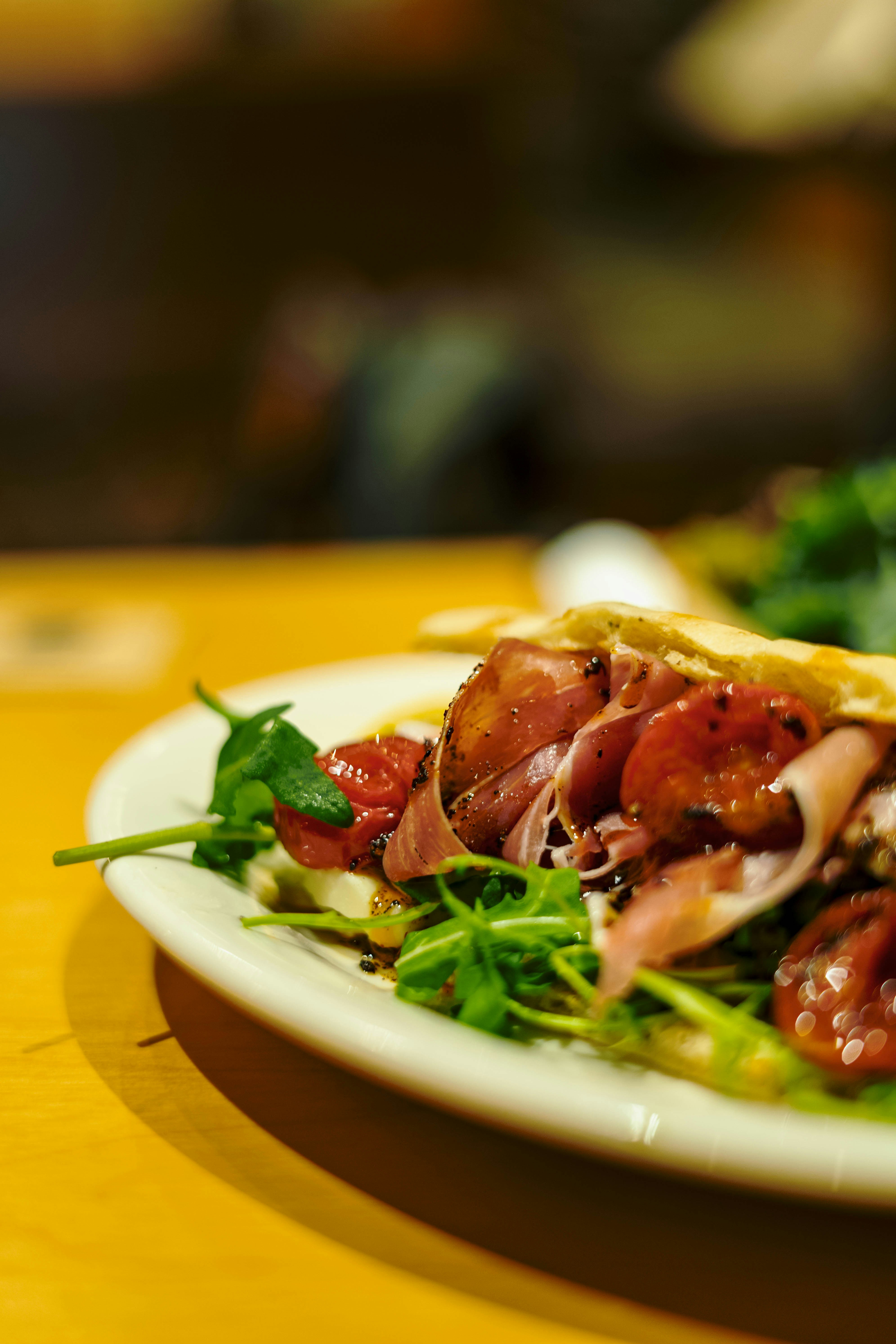 Cured ham crown on a bed of greens with toasted bread