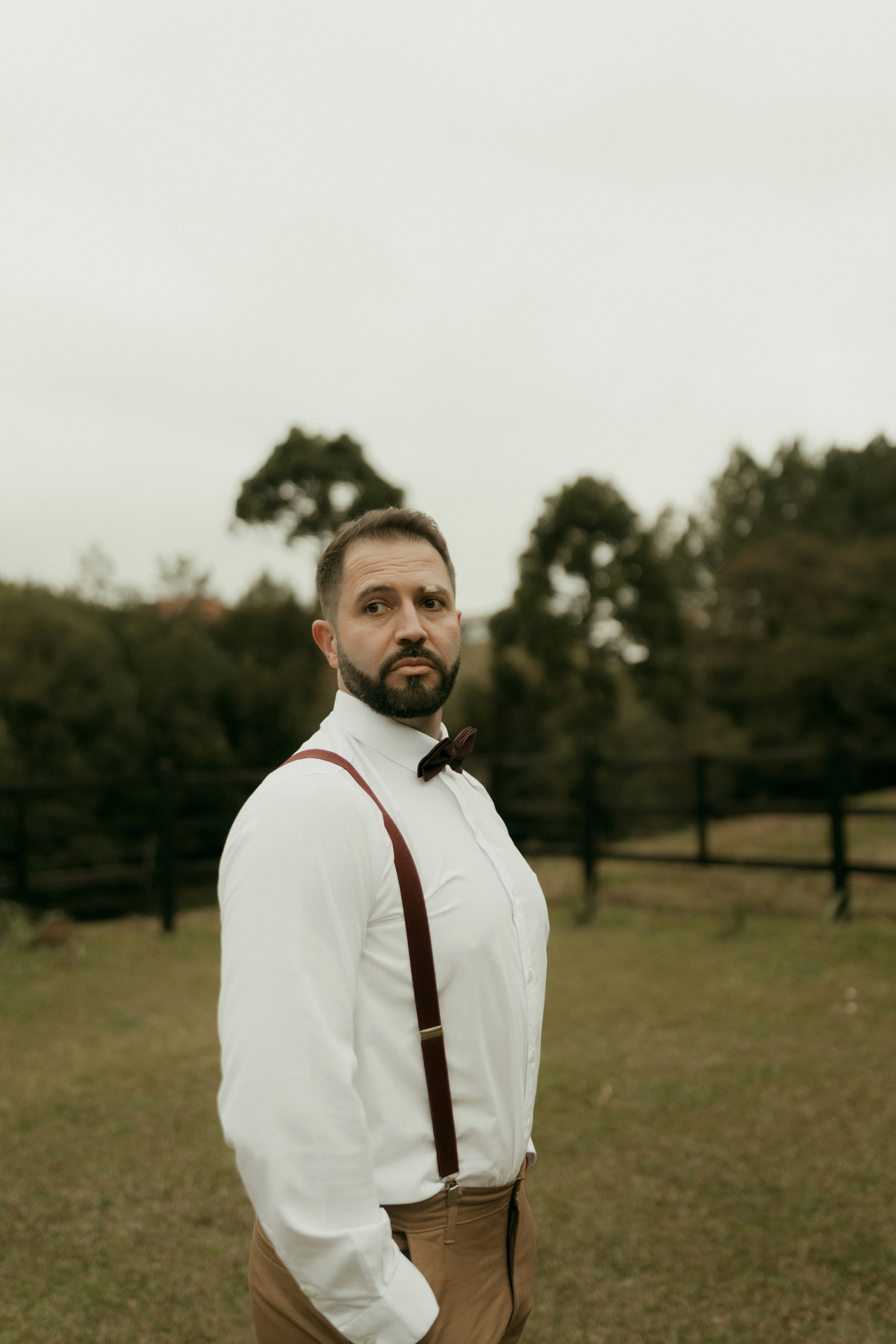 Gentleman in suspenders beneath autumn skies
