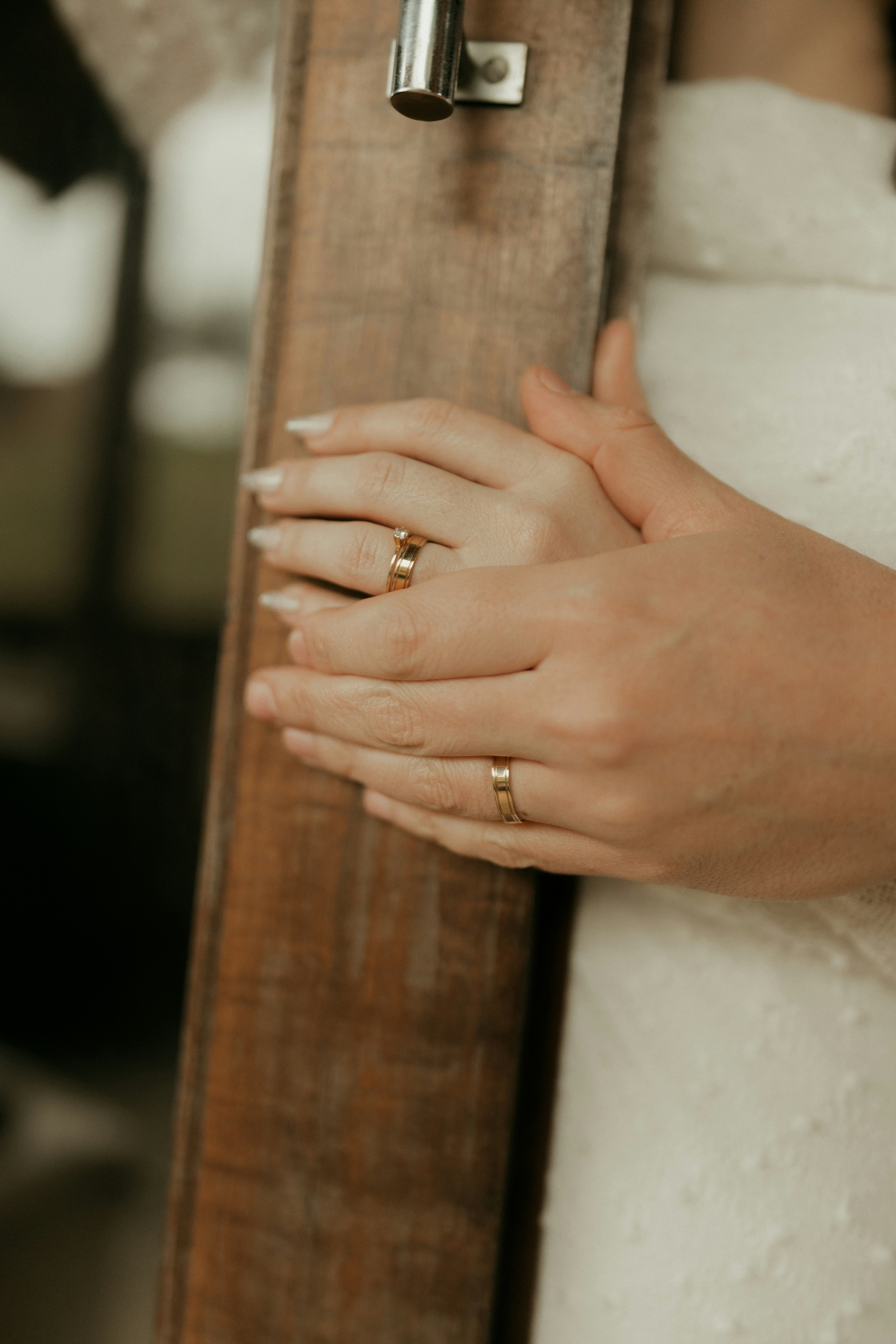 Hands of Commitment: Gentle Grasp at a Wooden Threshold