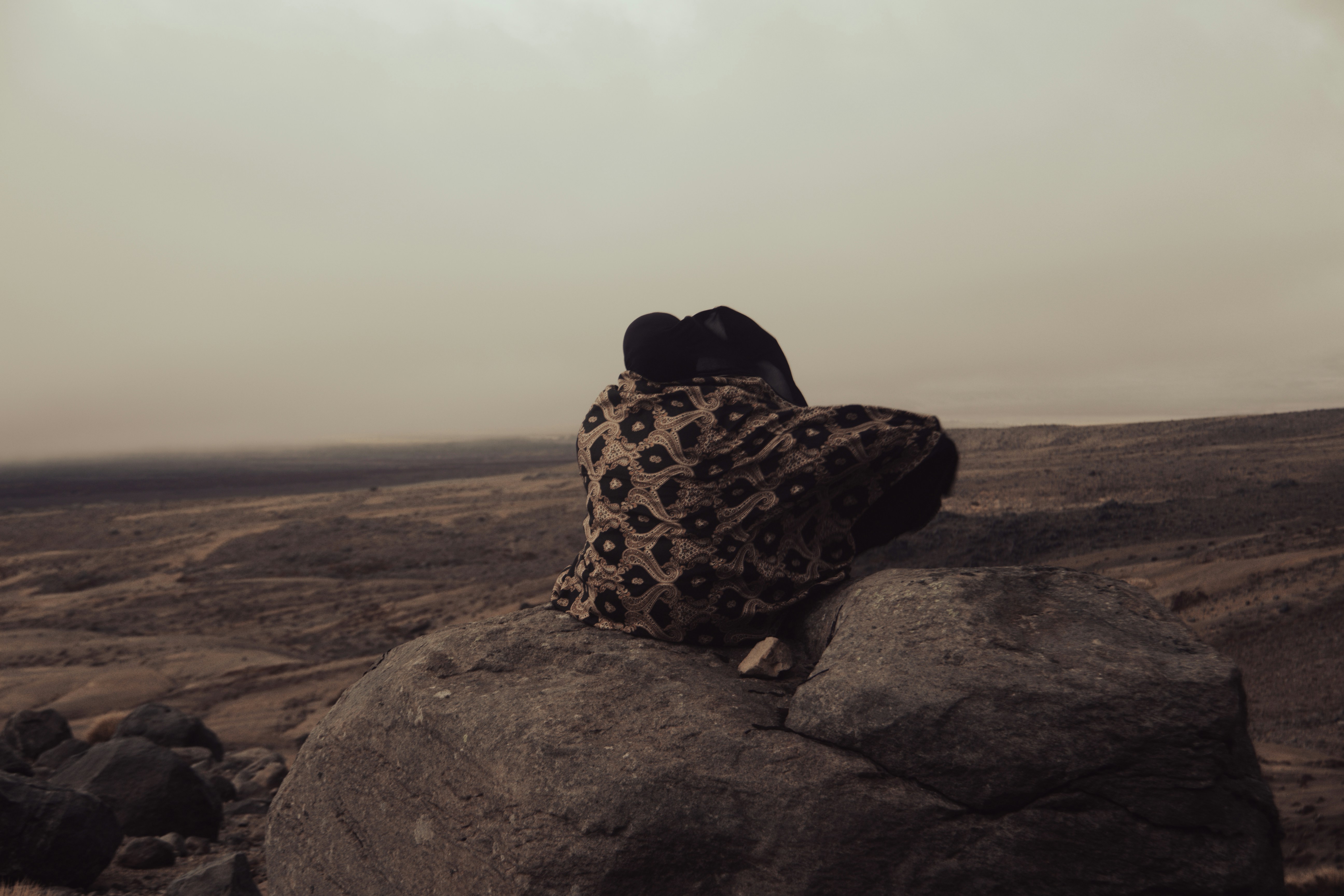 Deserted Climber on a Weathered Boulder at Dusk