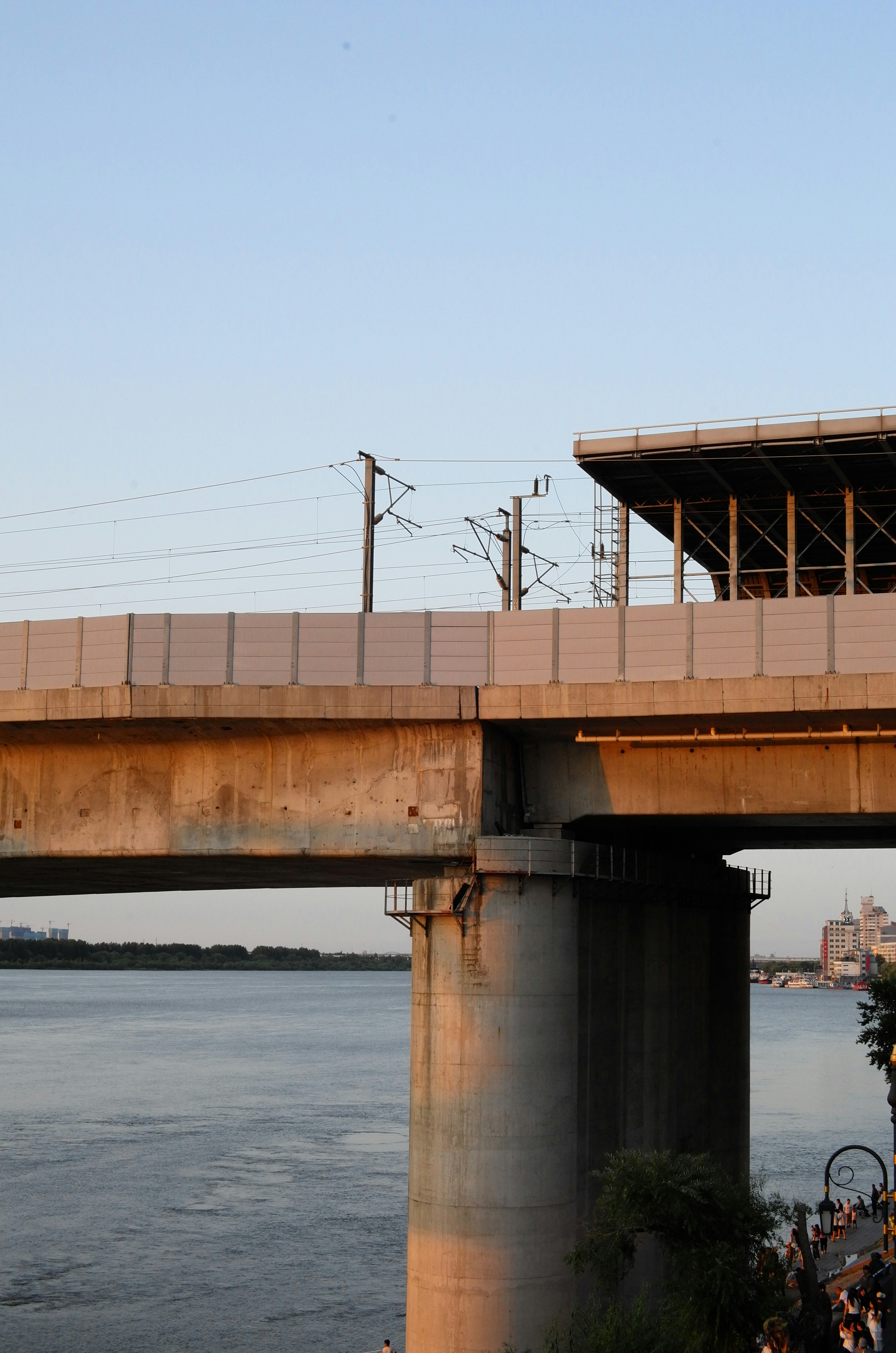 Concrete Arc over the Riverside: A Sunset-Warm Bridge Vista
