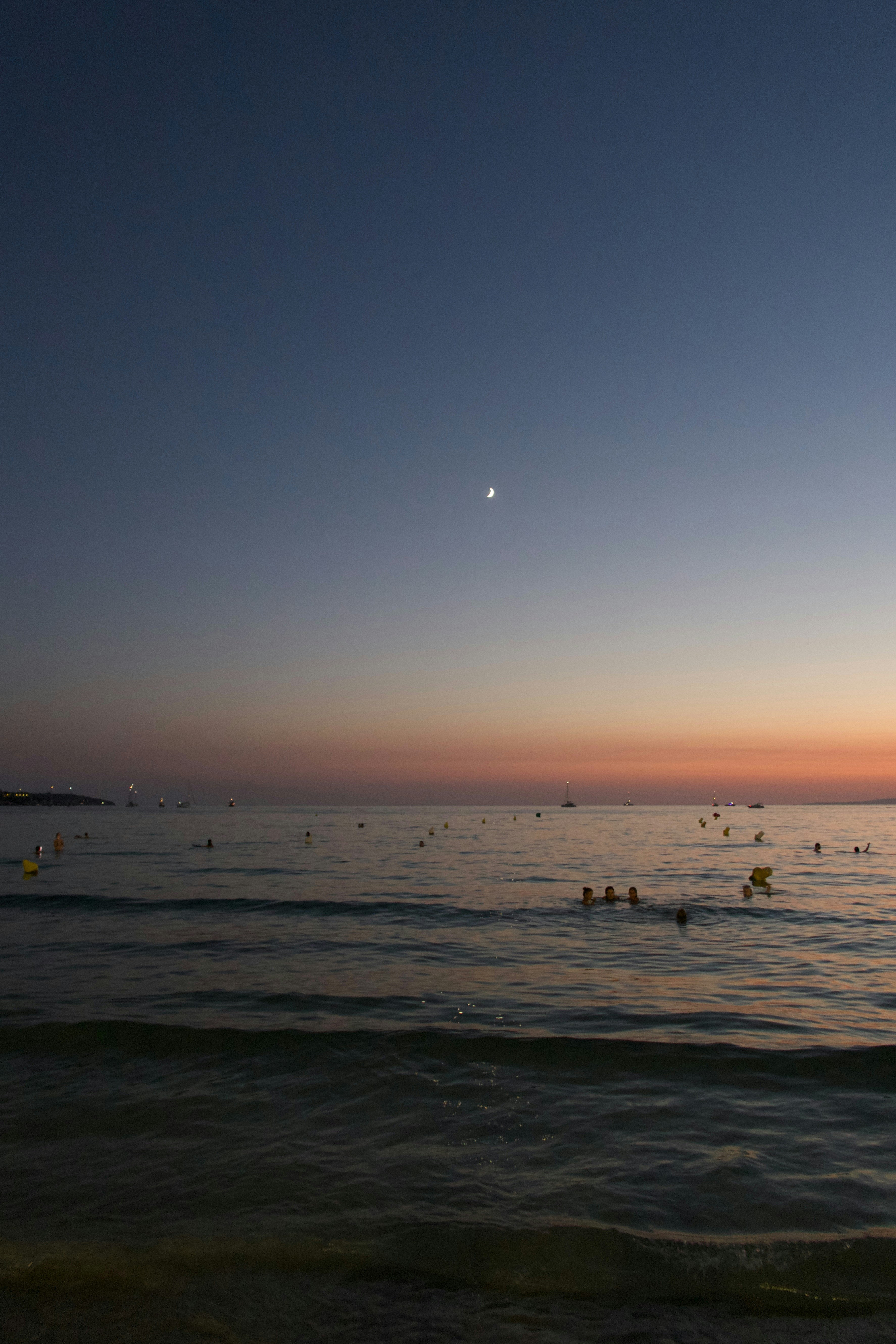 Moon over a Calmed Horizon at Sunset
