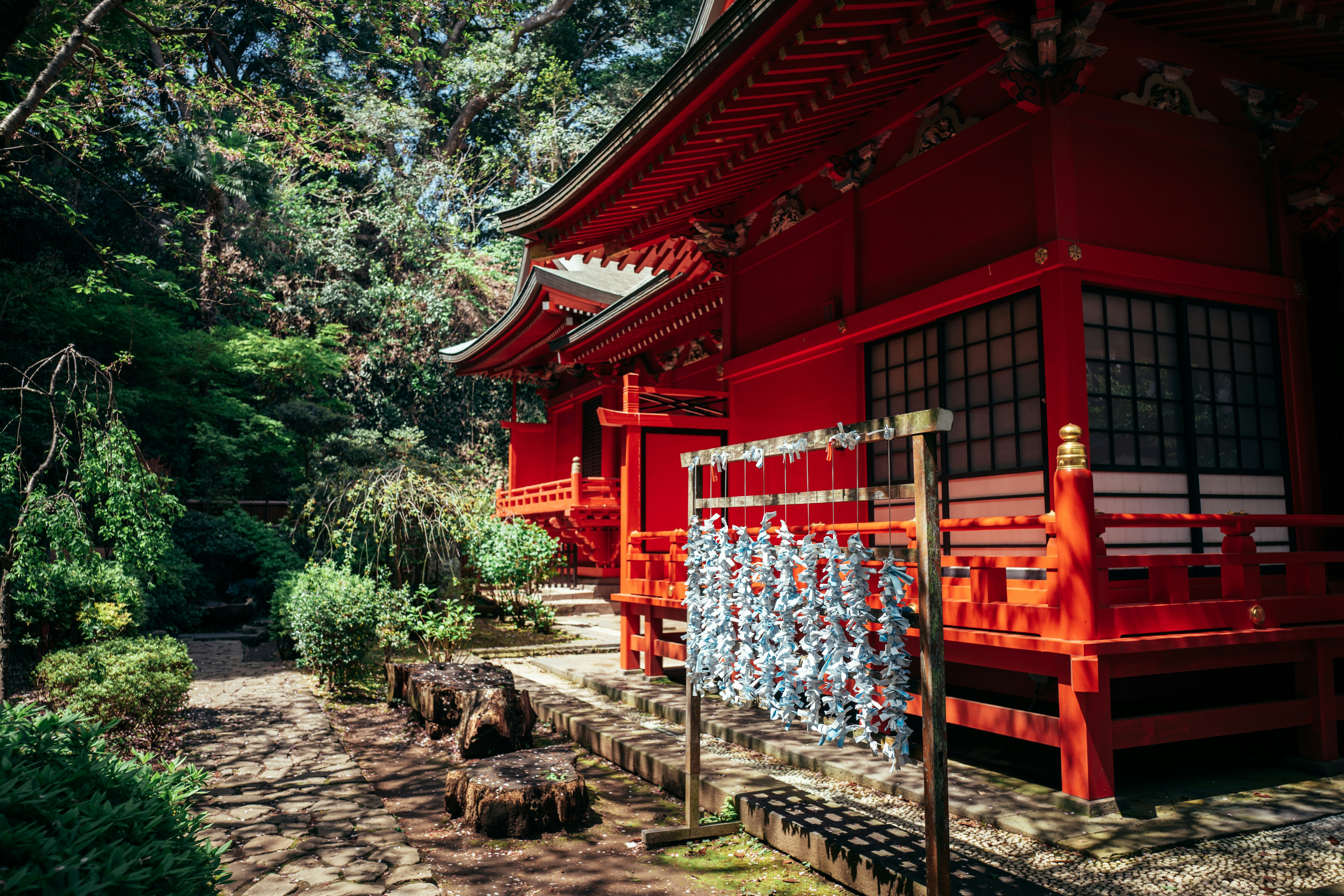 Crimson Shrine in the Sunlit Garden