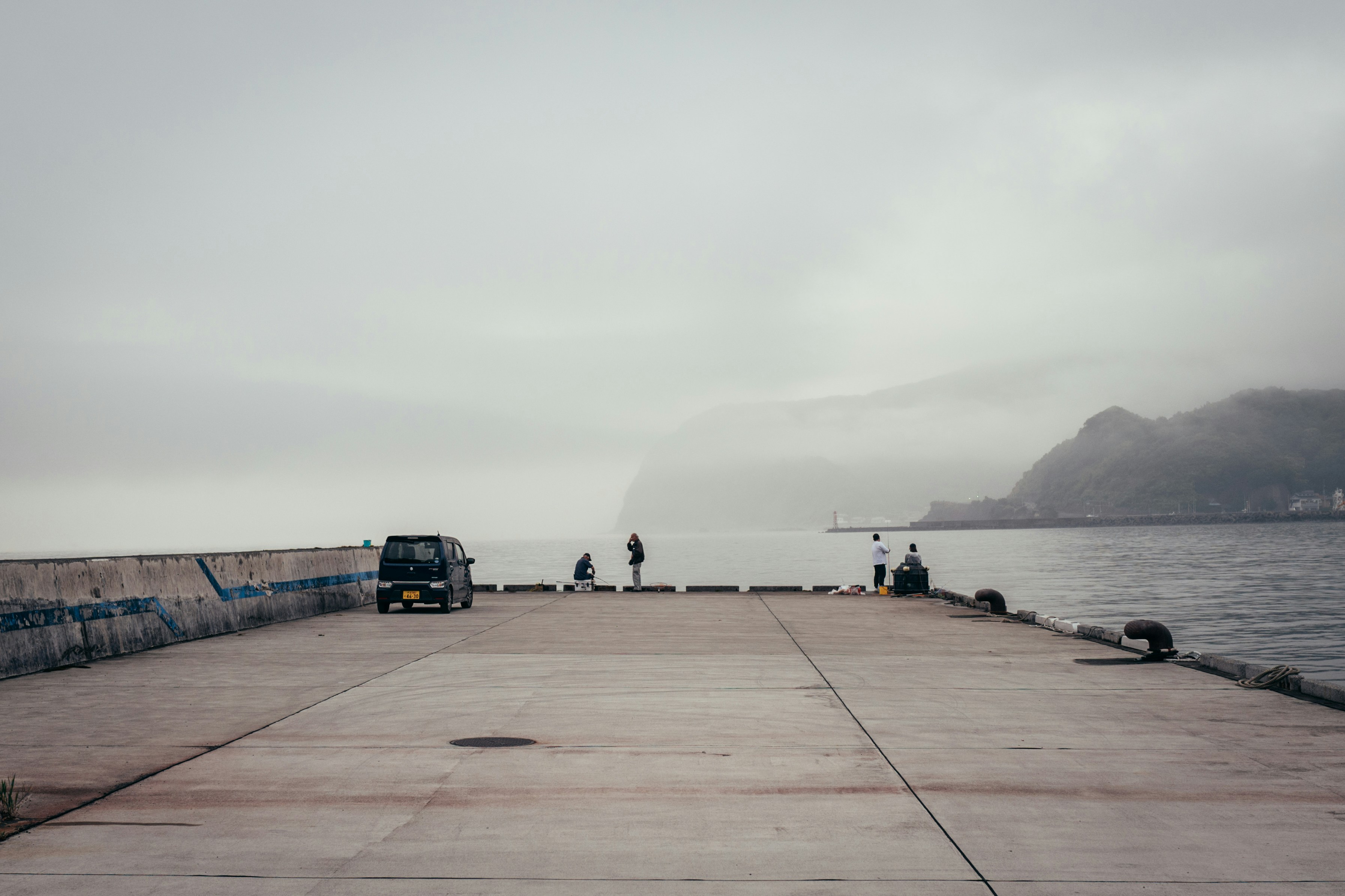 The Quiet Pier: A Misty Convergence of Sea and Sky