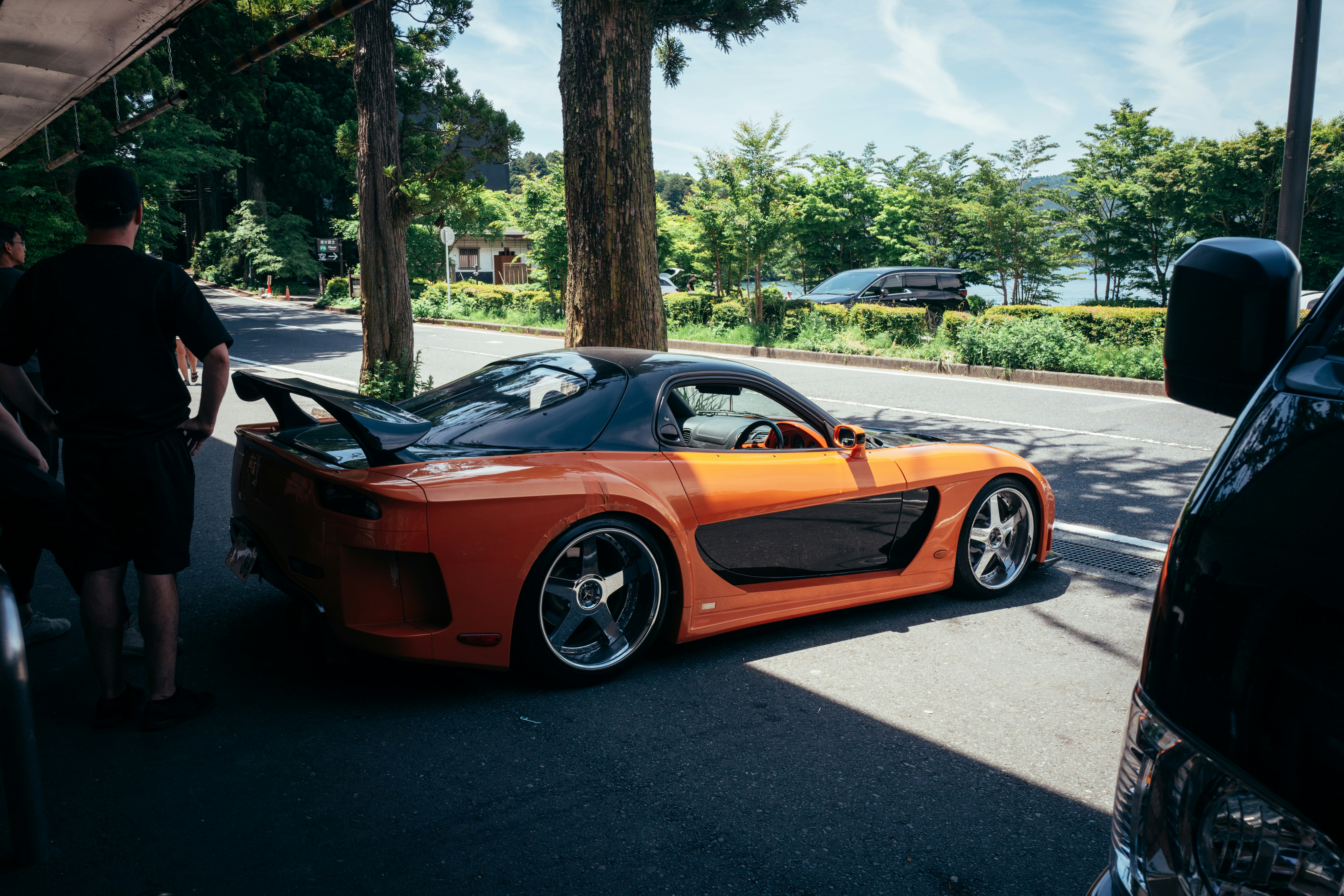 Orange Shadow: A Confidential Mid-Engine Sunset in the Parking Lot
