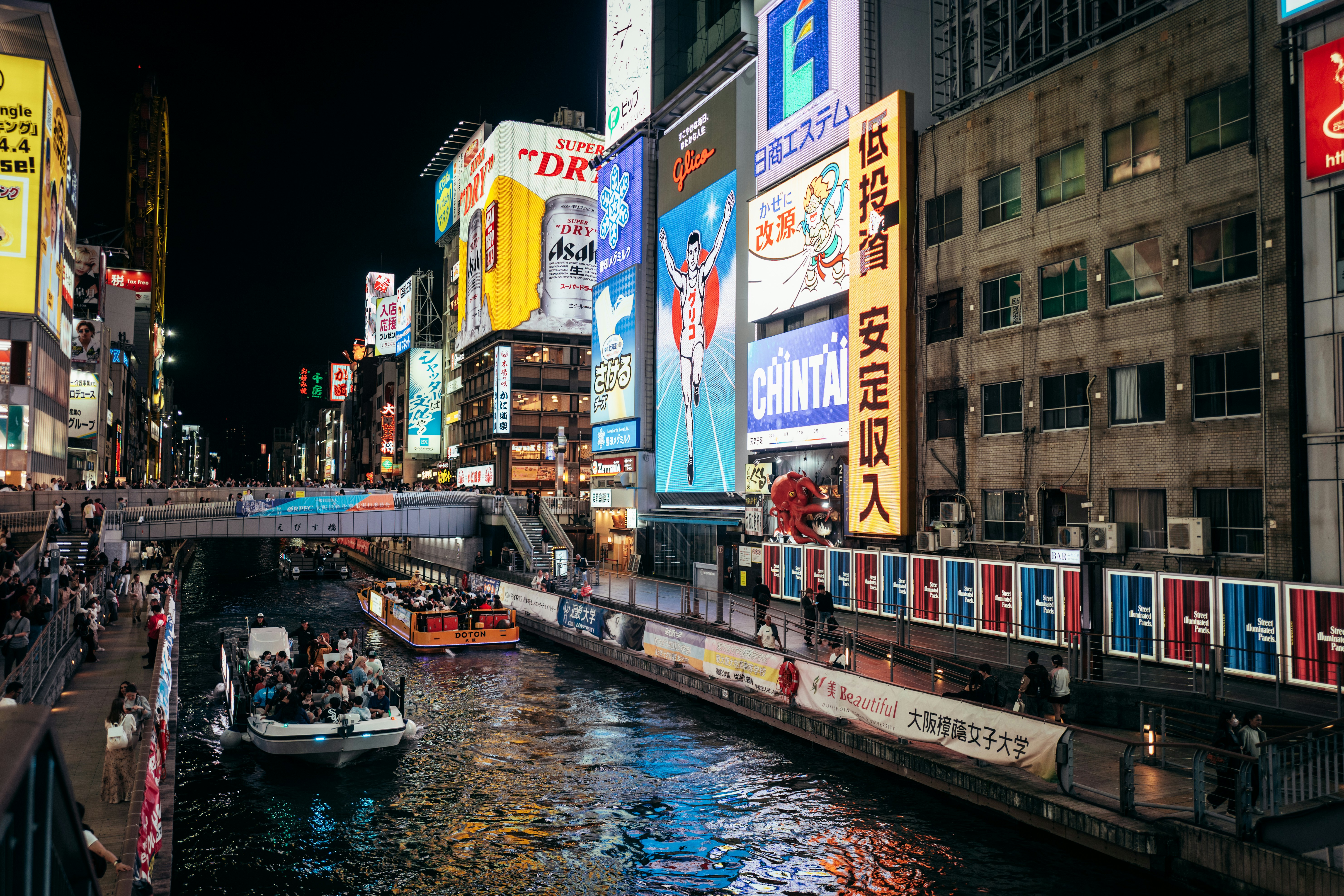 Neon Canalfront: City Lights Reflect on the Waterway