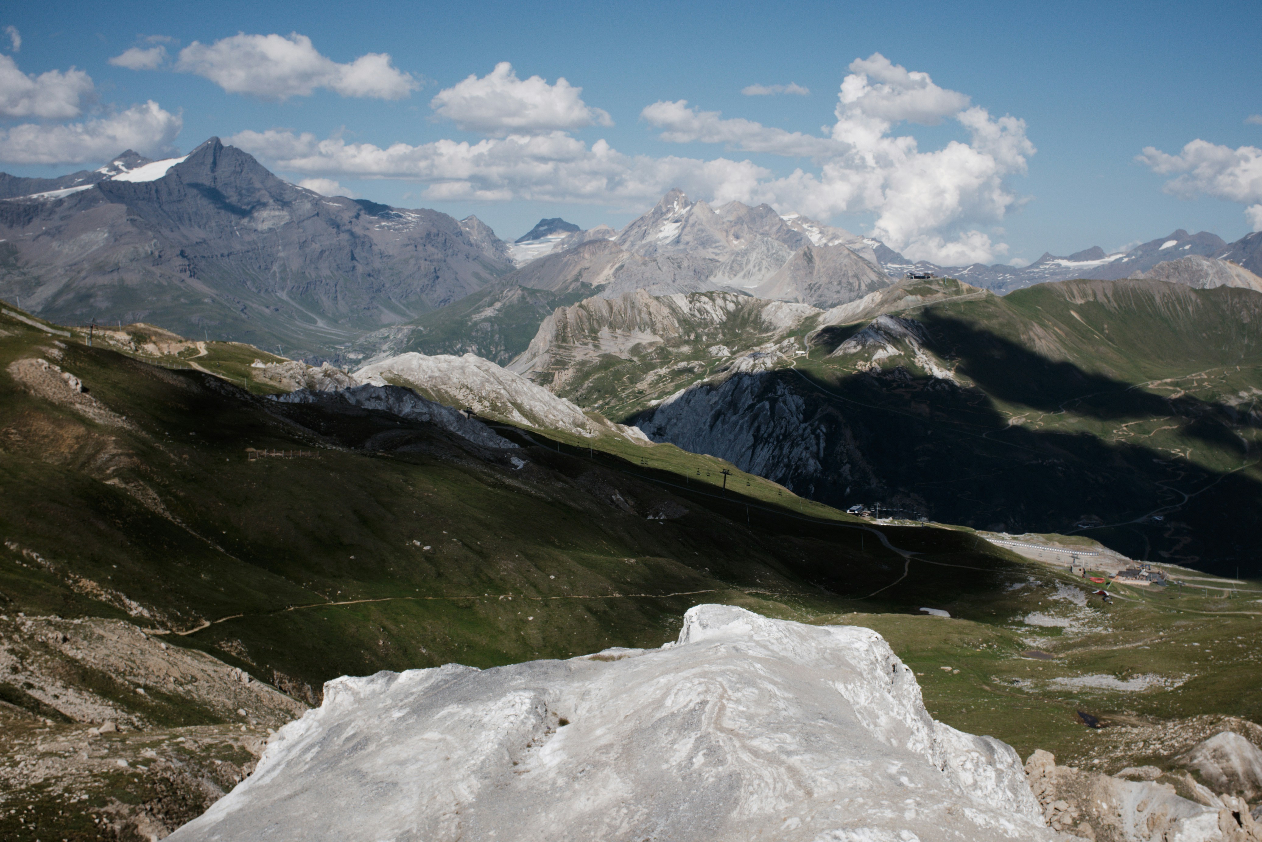 Far-flung Alps: A sweeping rocky foreground under a cathedral sky