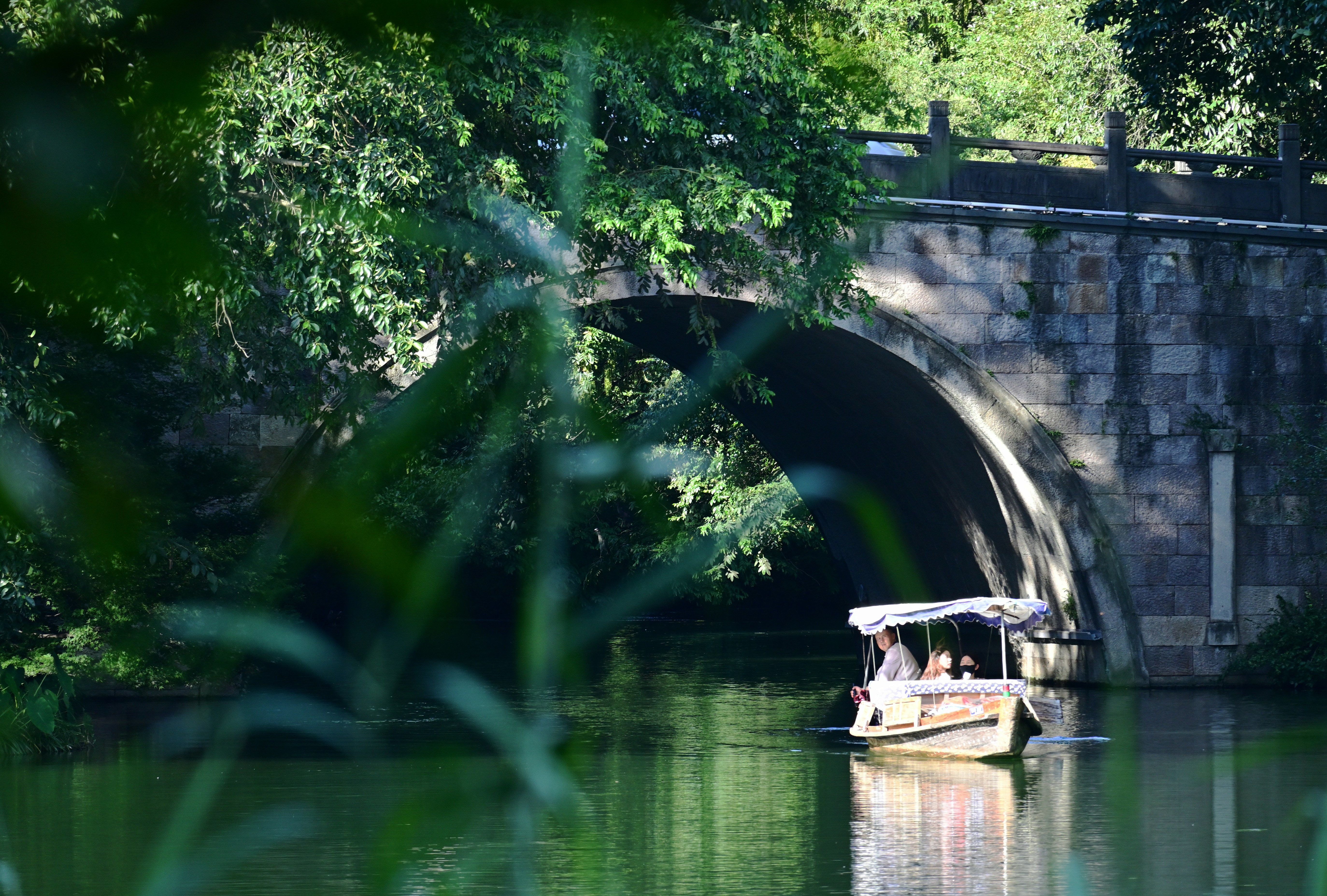 Boat Trail Under the Stone Arch: Quiet River Scene
