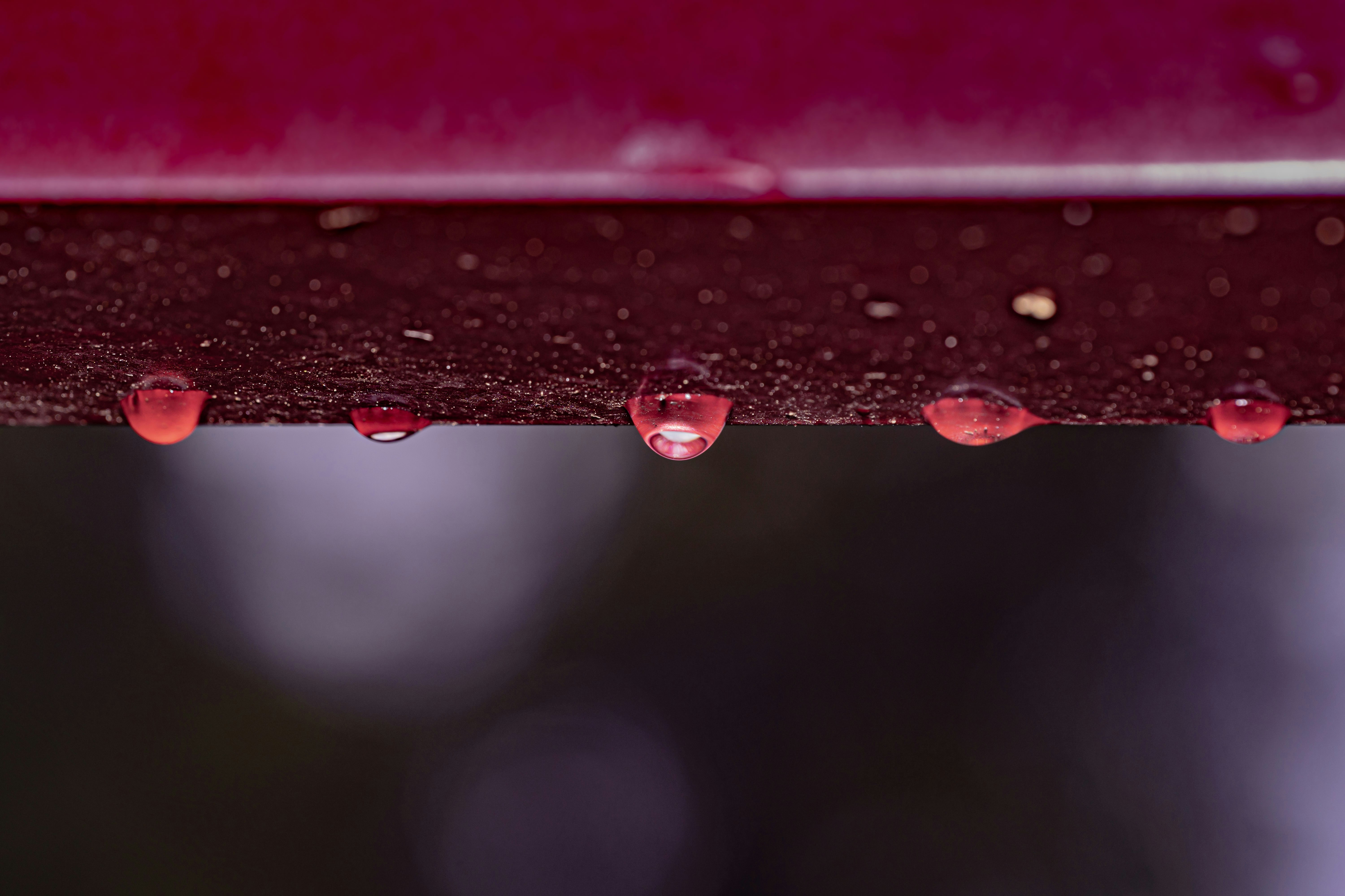 Droplets on a Crimson Edge