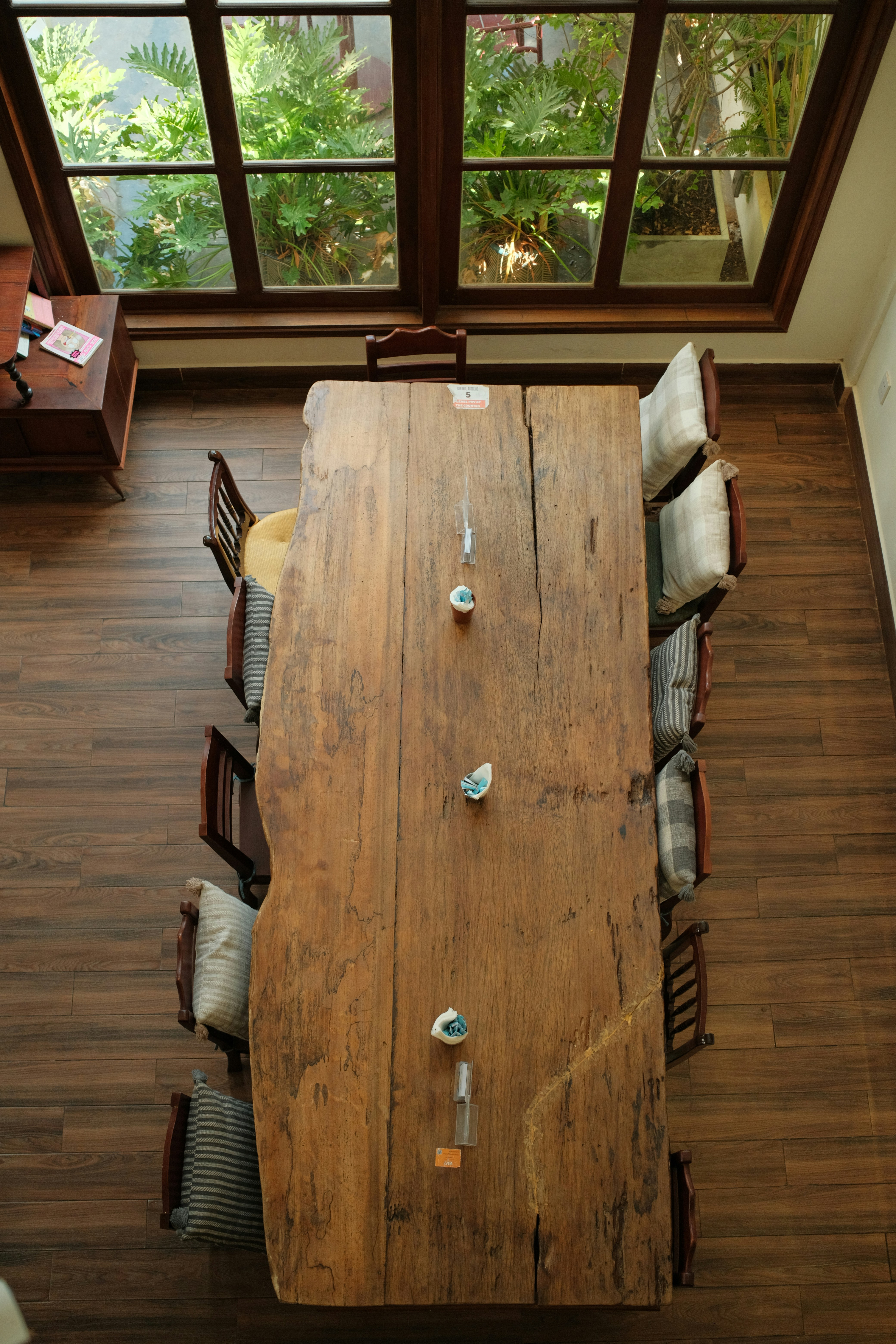 A Rustic Boardroom from Above: A Long Wooden Table in Quiet Afternoon Light