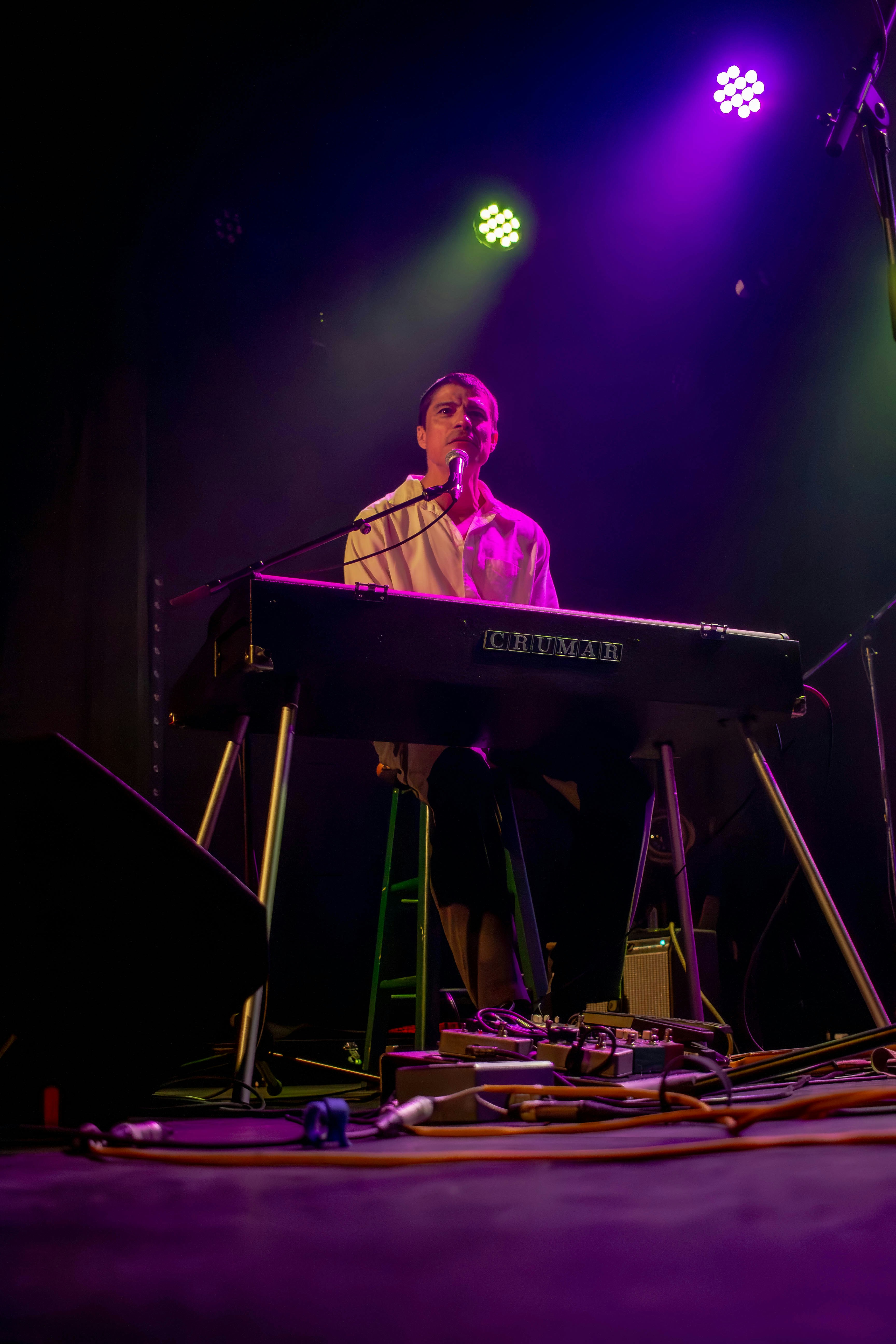 Midnight Keys: a pianist under neon spoons of color