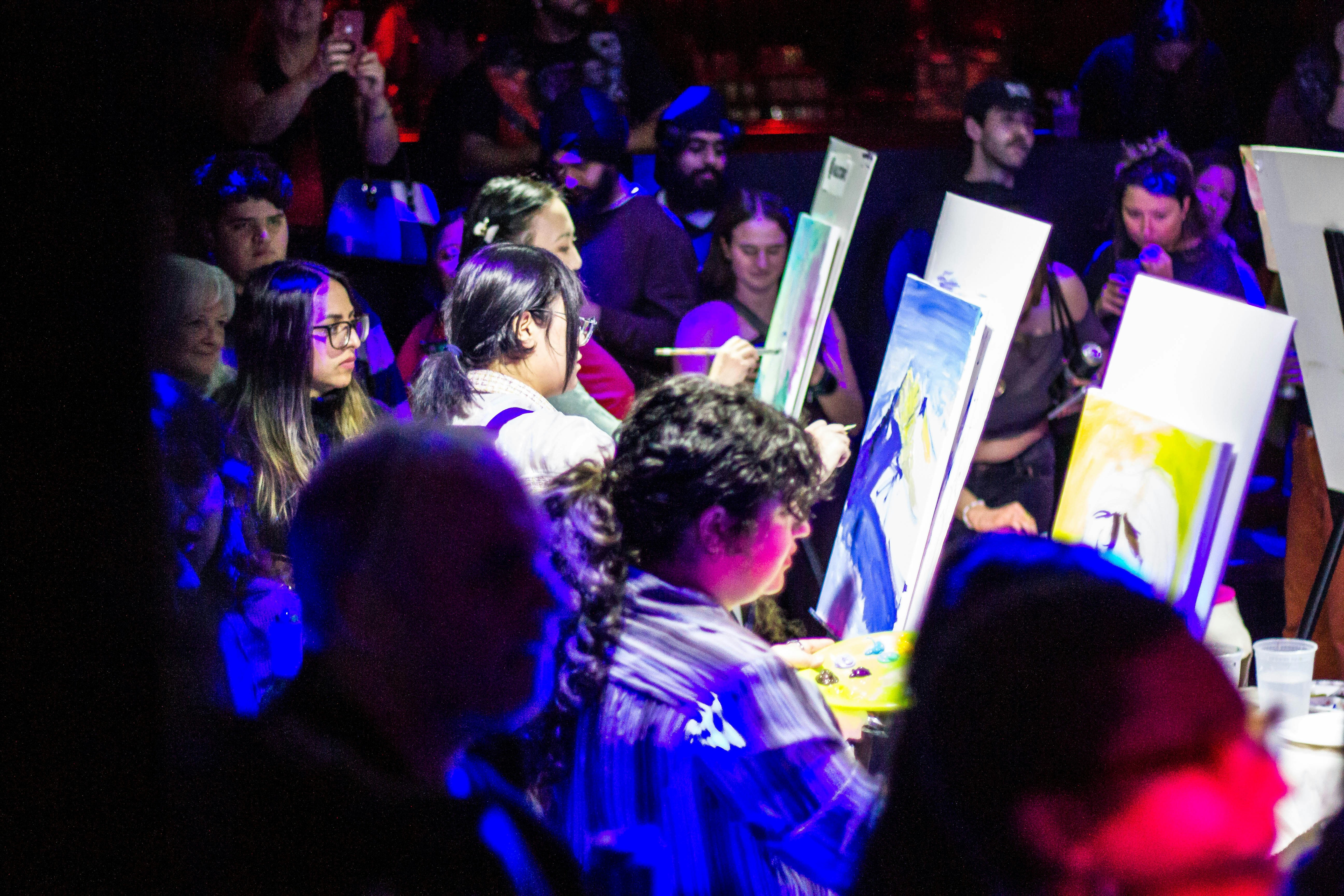 Midnight Studio: Enthralled Crowd Basks in Painted Light