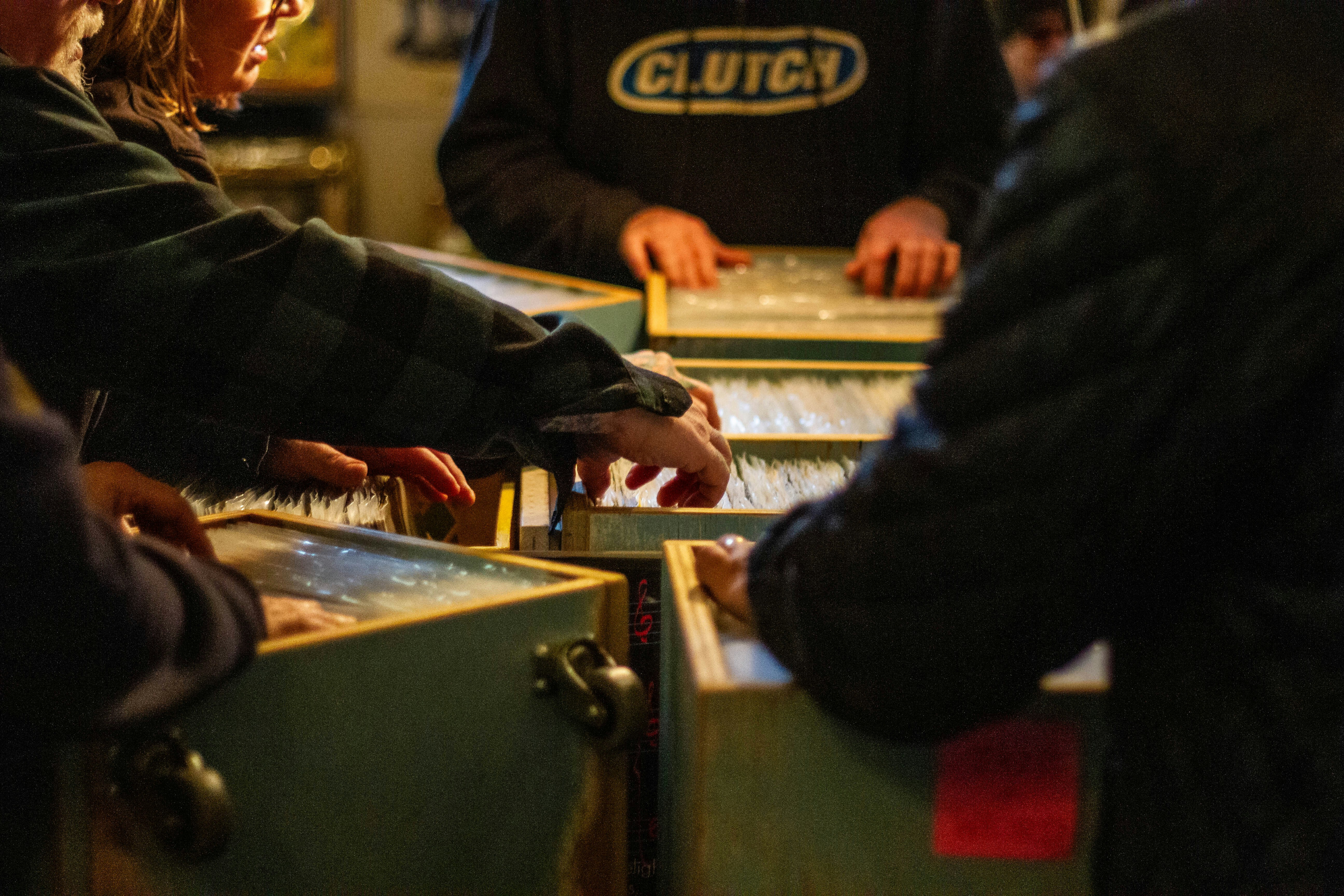 Hands in motion over a tense foosball playfield
