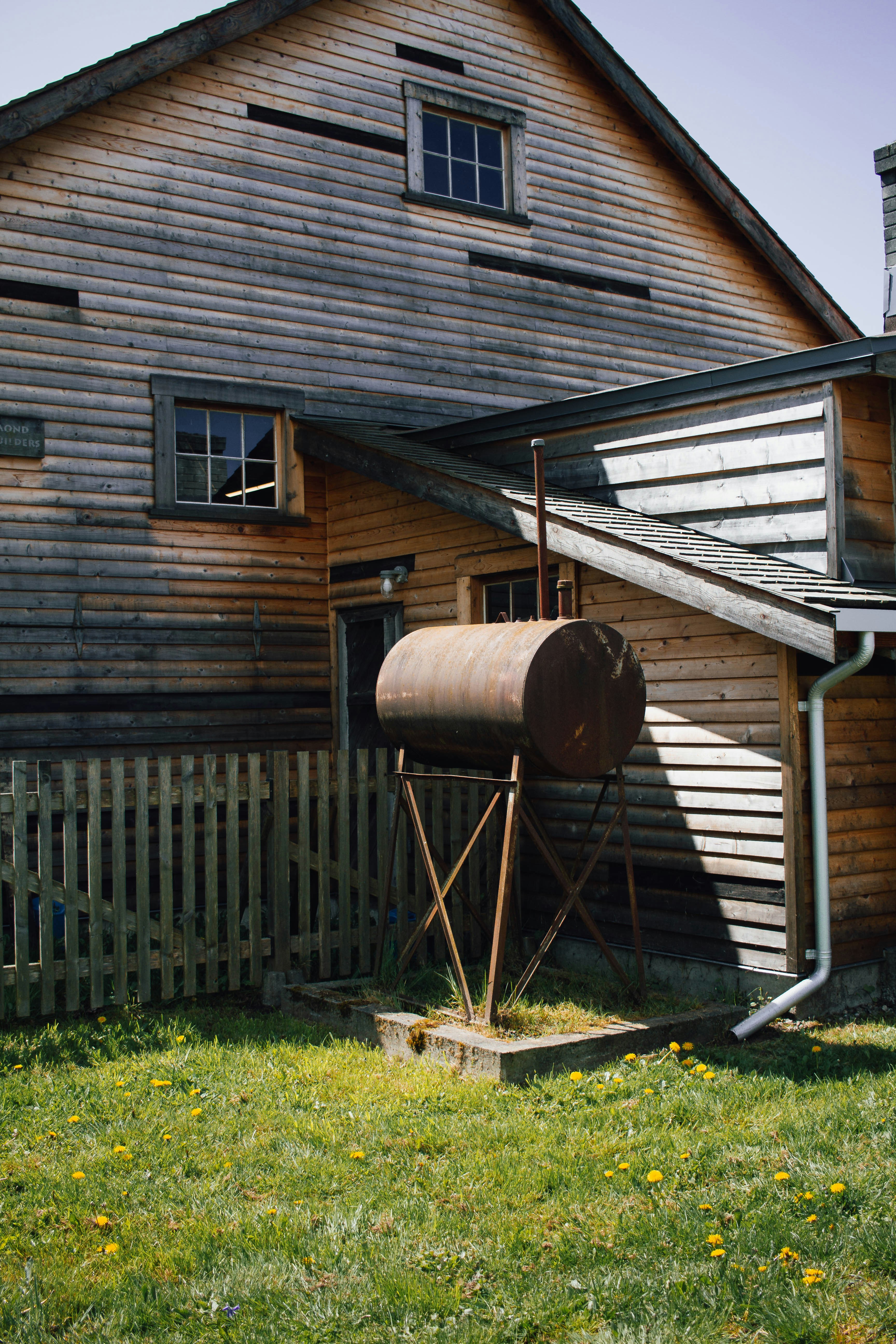 Weathered Barn and Water Tank: Sunlit Geometry of a Rustic Outpost
