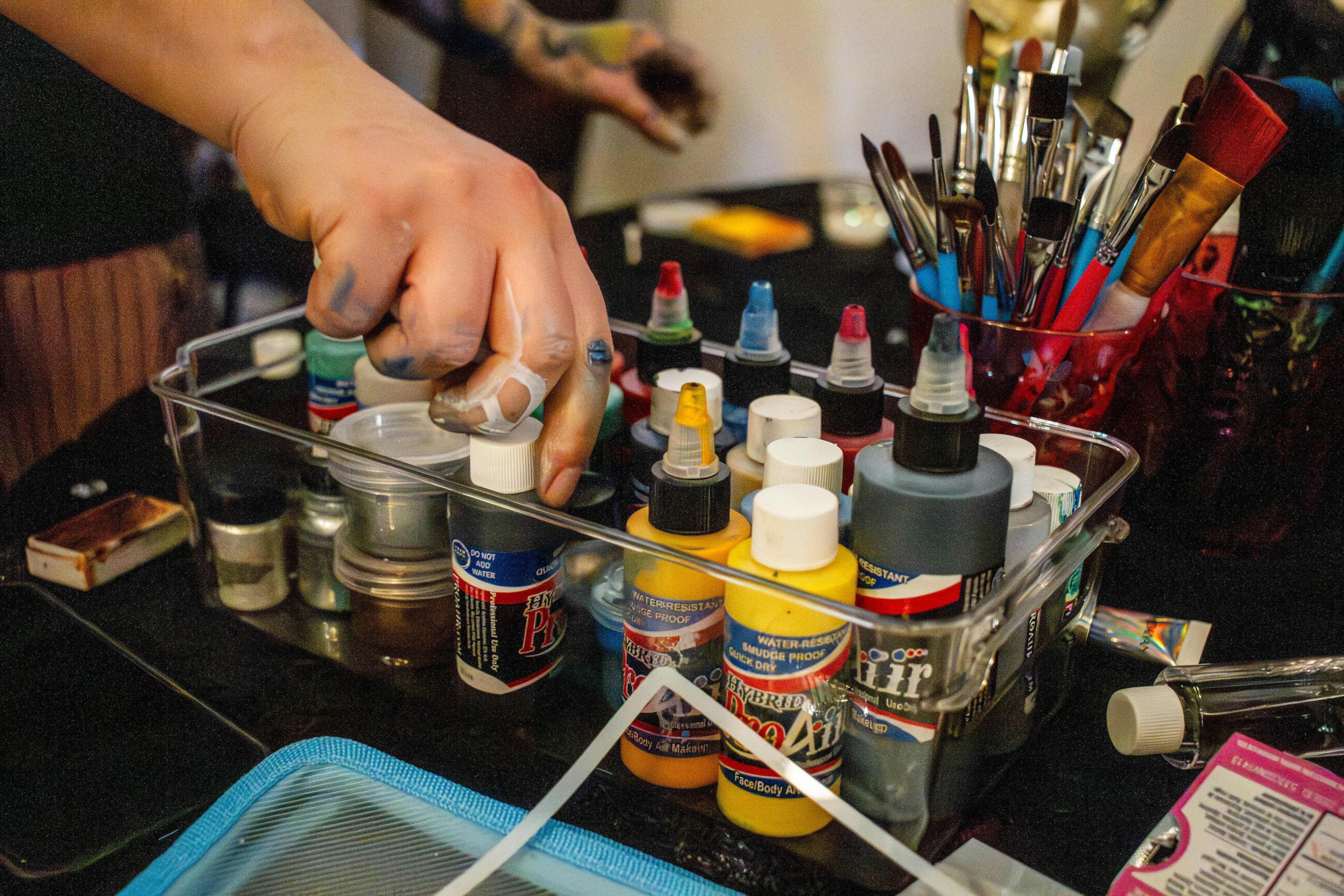 Nimble Fingers Meet a Palette of Bottles at a Busy Studio
