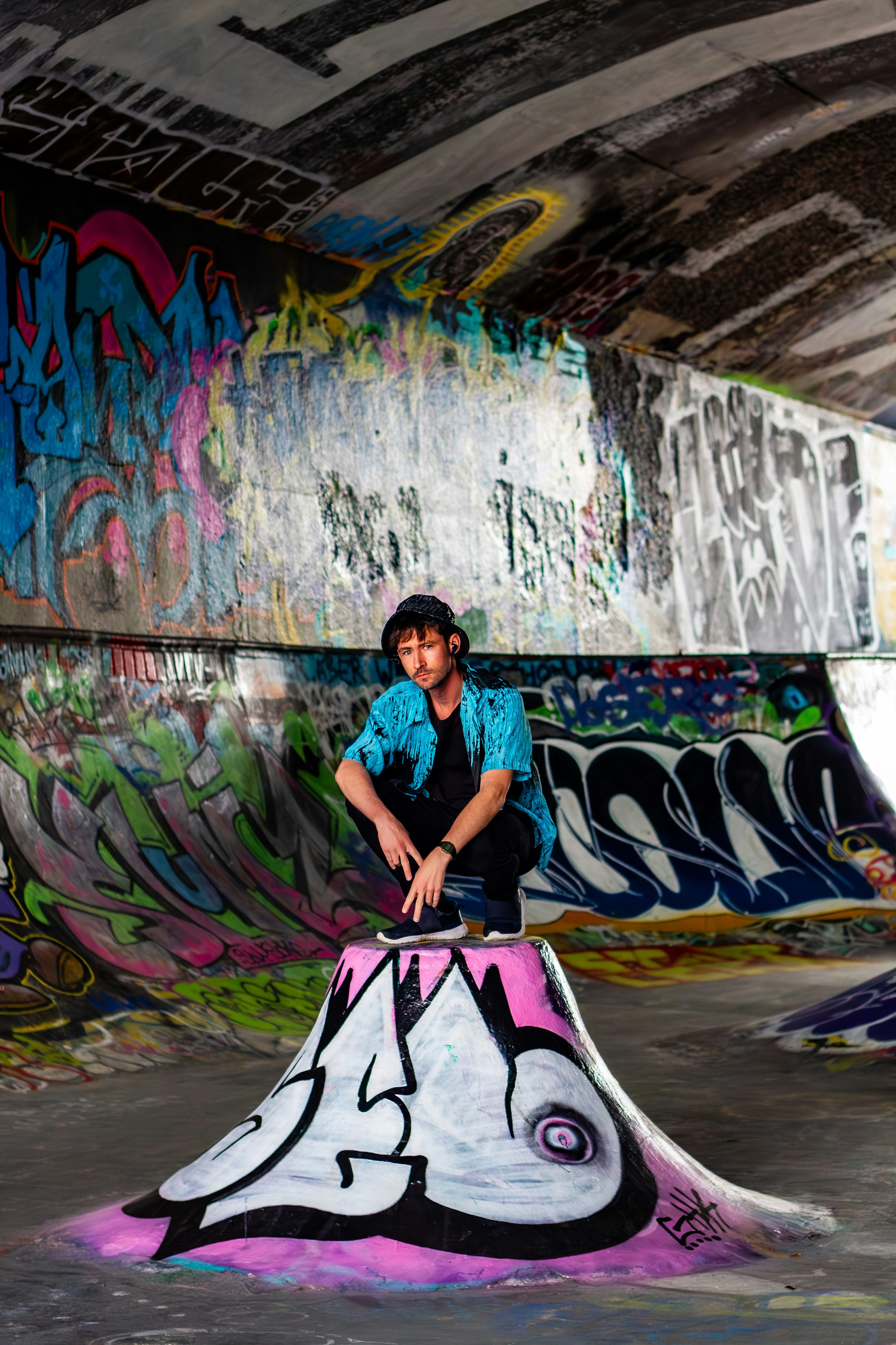 Skull-Capped Skater at Graffiti Bowl