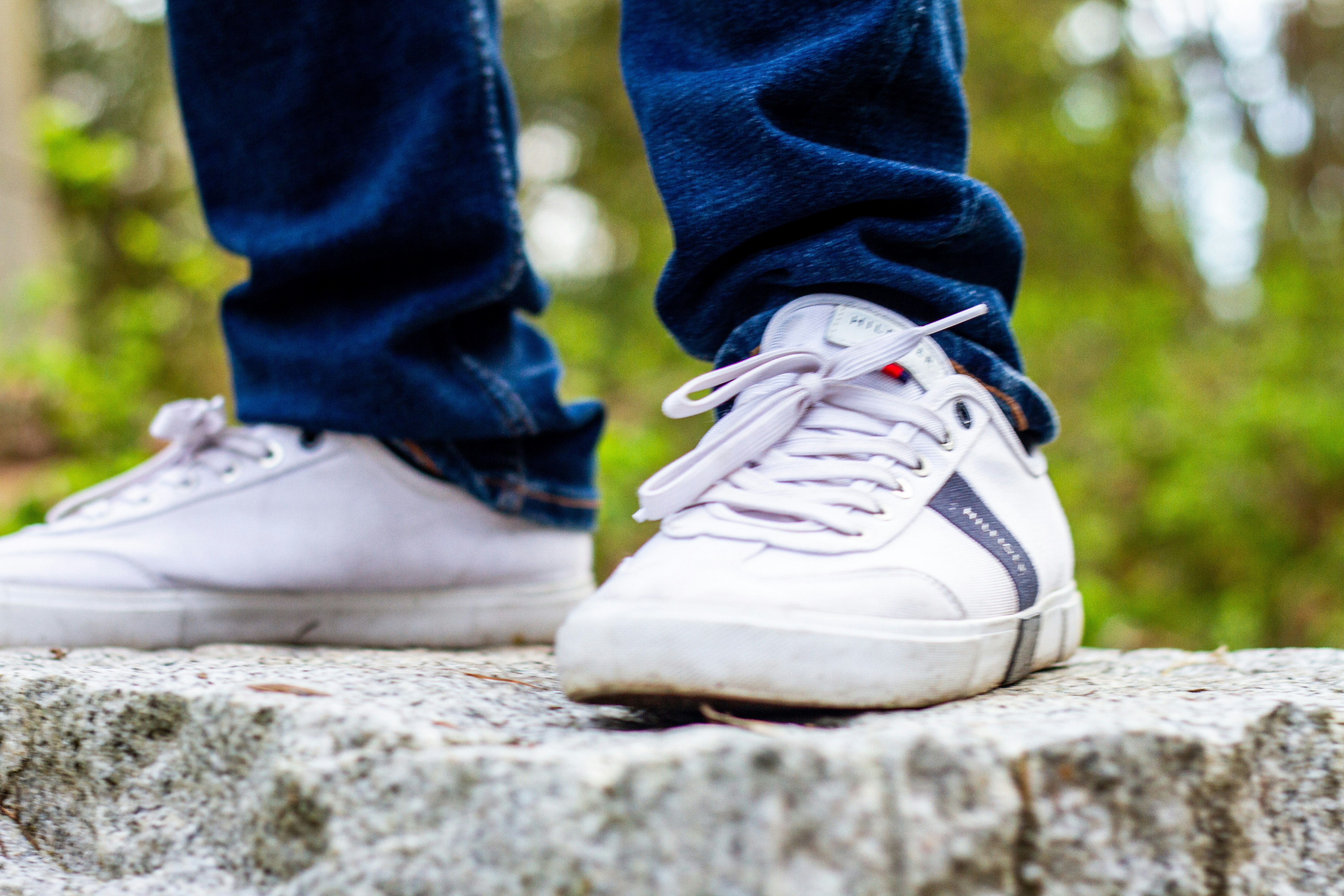 Close-Quarters Footing: White sneakers on a textured stone edge