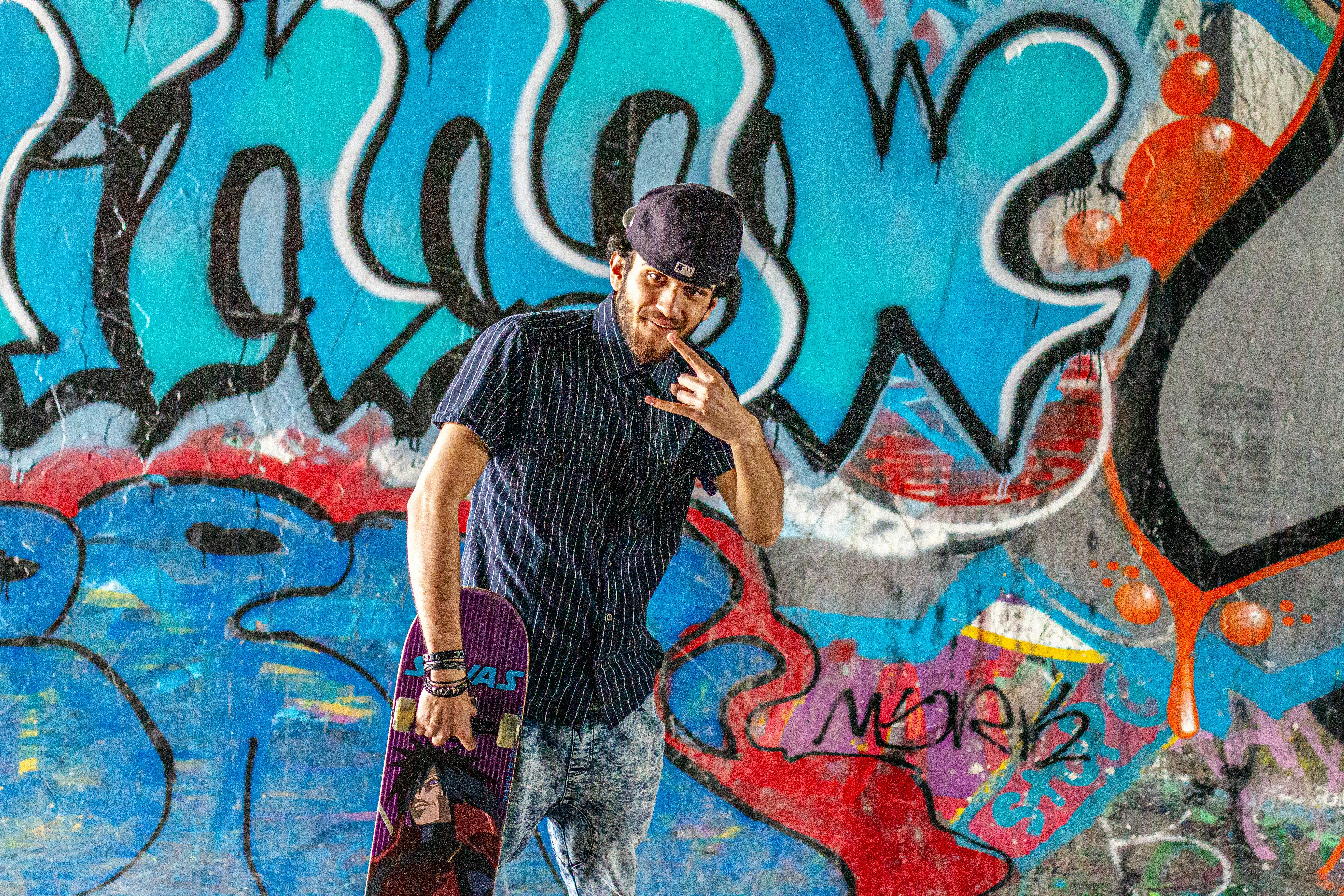 Skater in Front of Neon Graffiti Wall