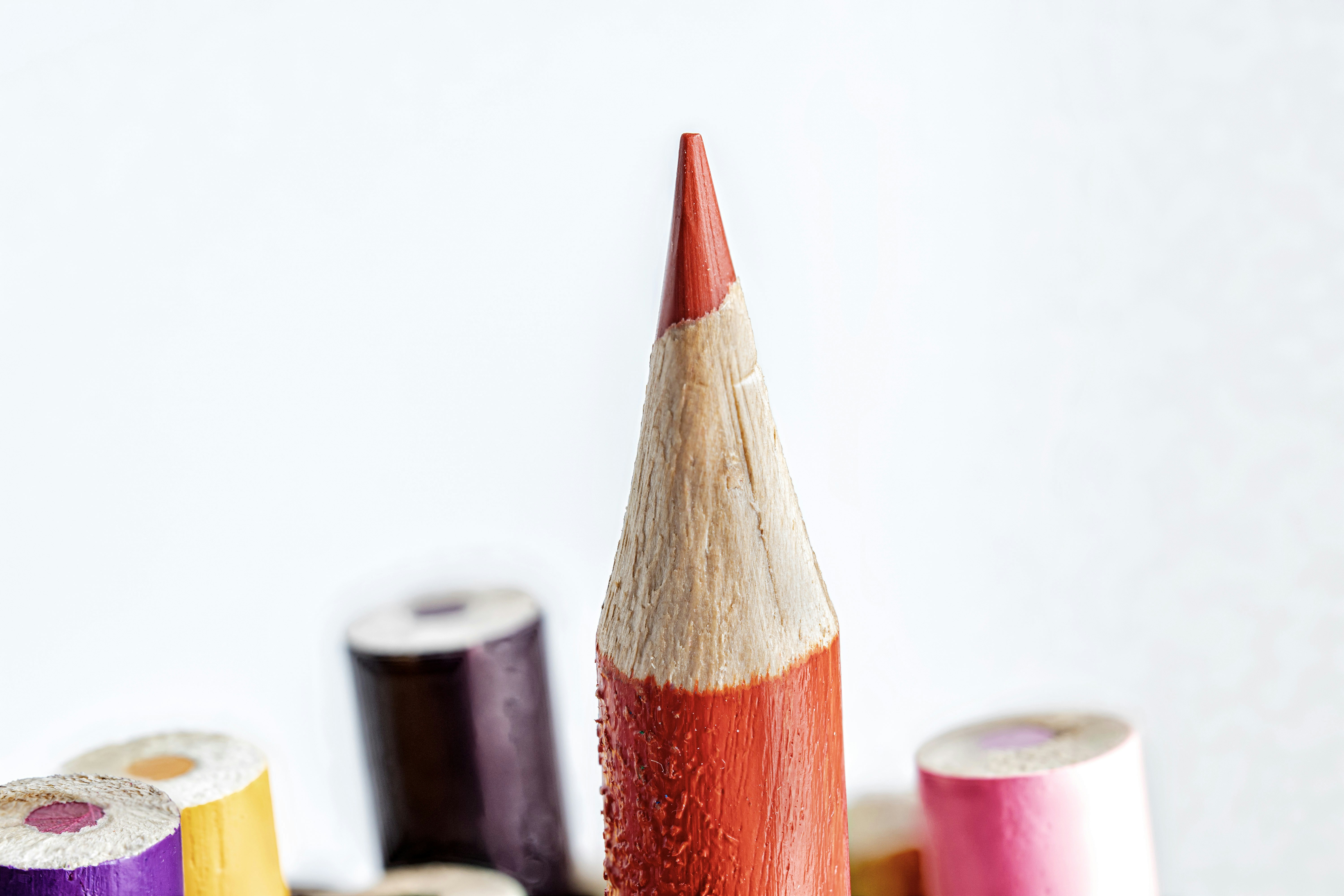 Crimson Core: The Center Pencil Among Pastel Stacks
