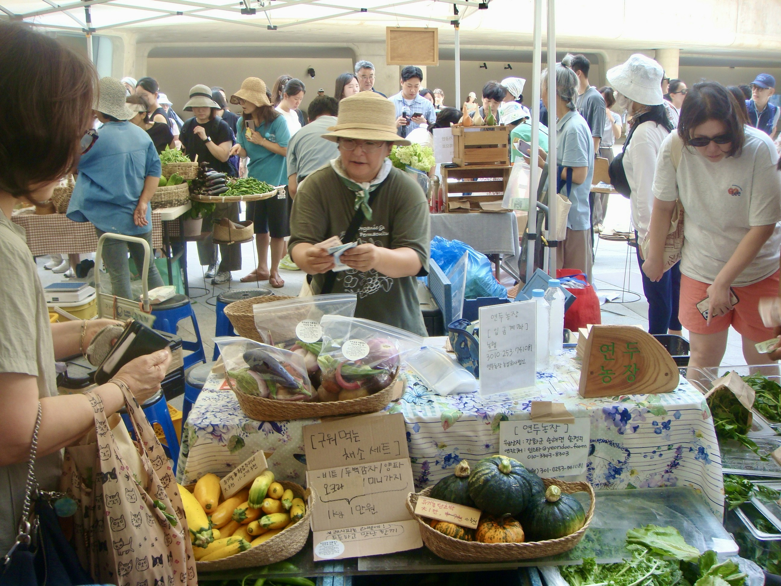 Green Market Vendor at a Bustling Outdoor Bazaar