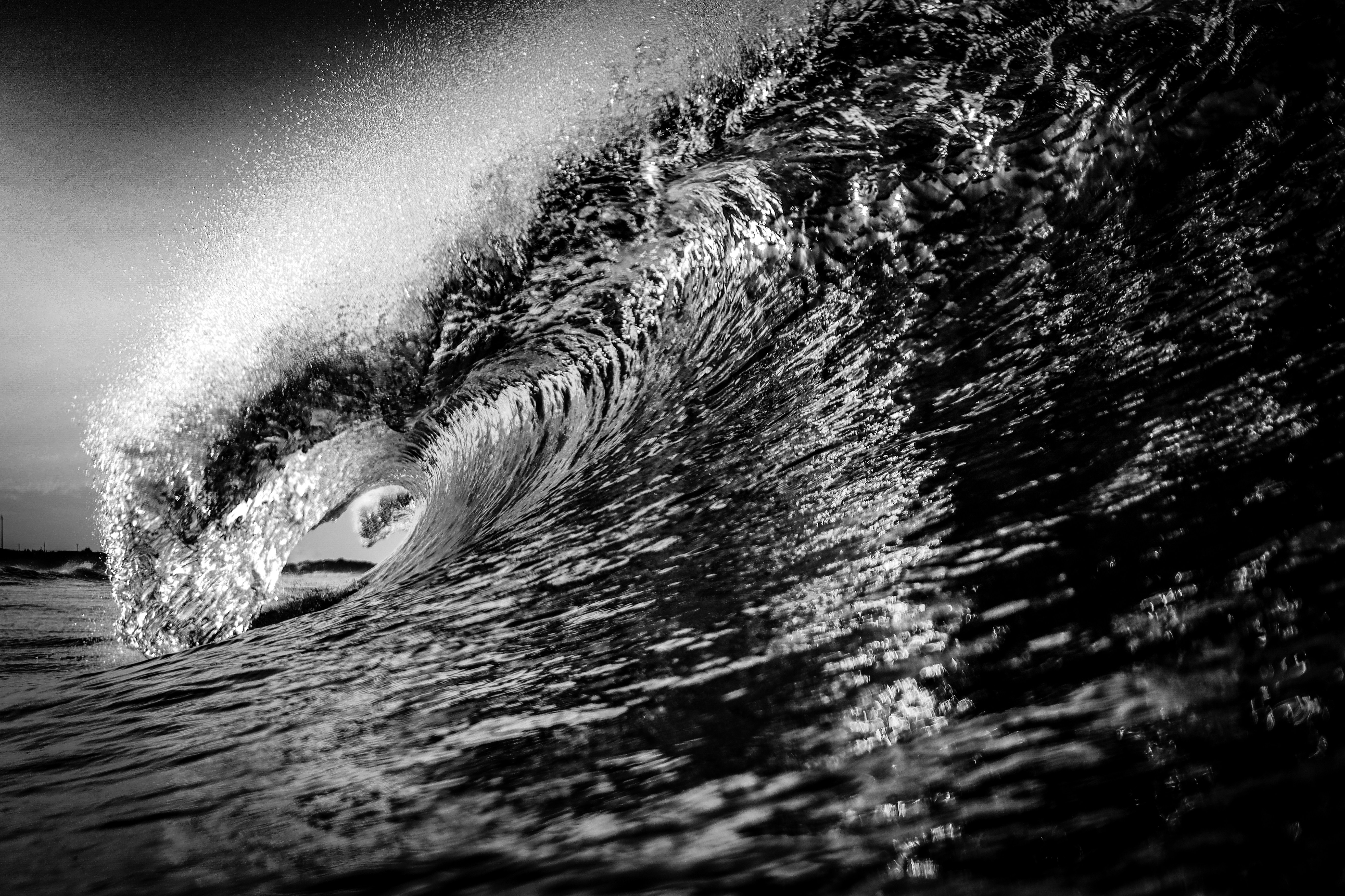 Curved Breaker: A Monochrome Surf Moment