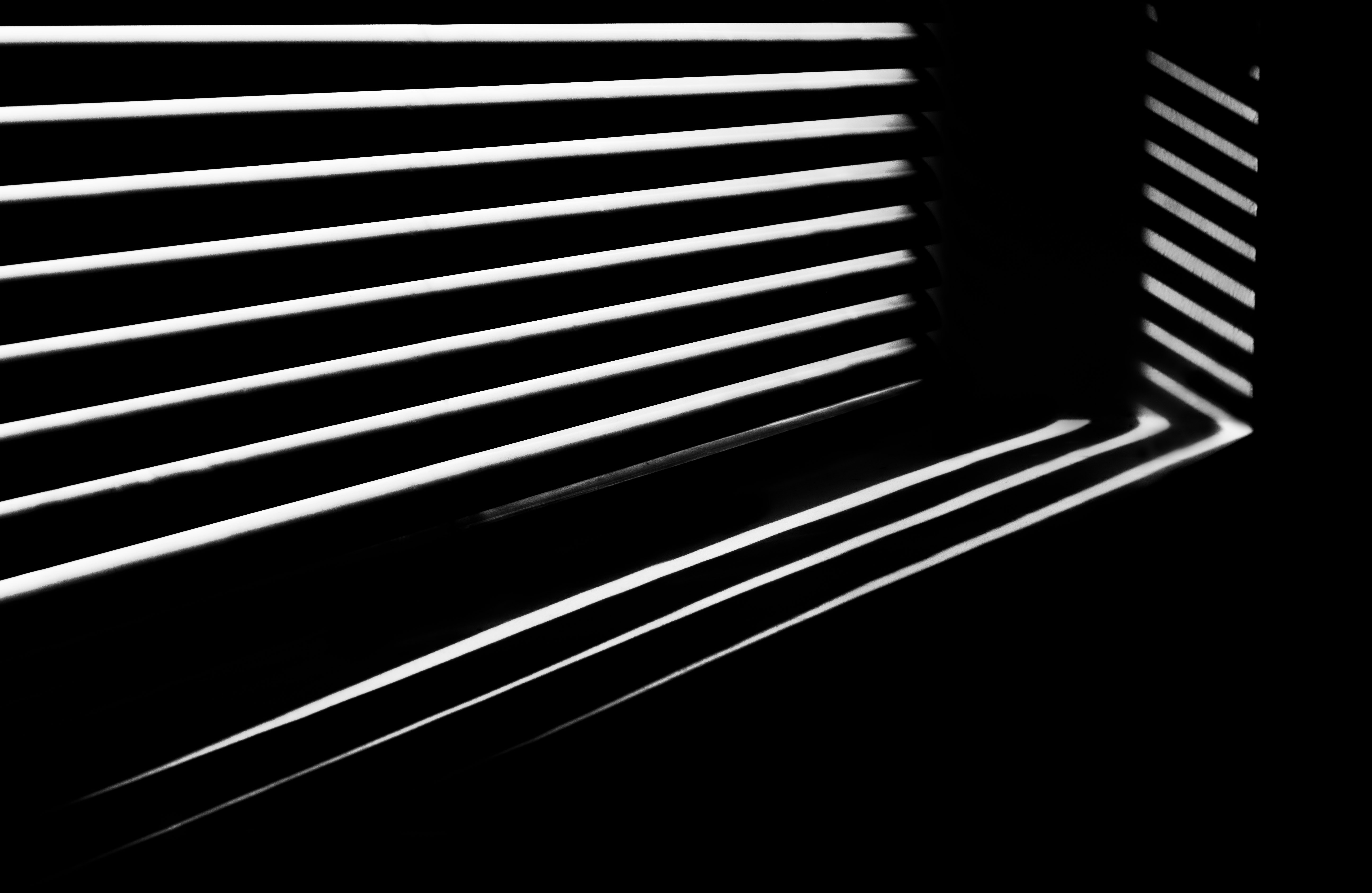 Stripes of Light: A Minimalist Window Scene in Shadow