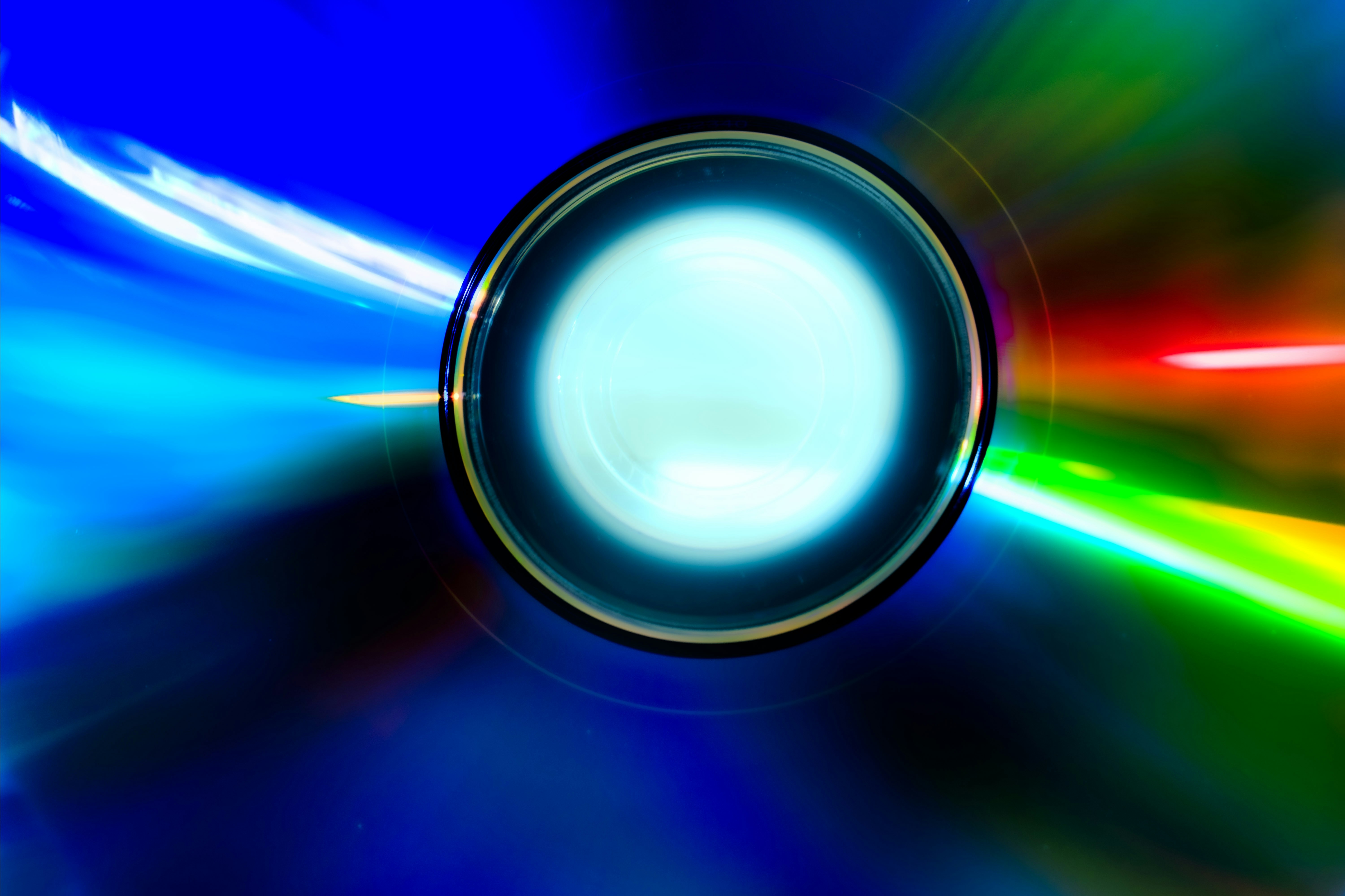 Chromatic Lens Burst: A Central Light Ring Streaked by Colored Wake