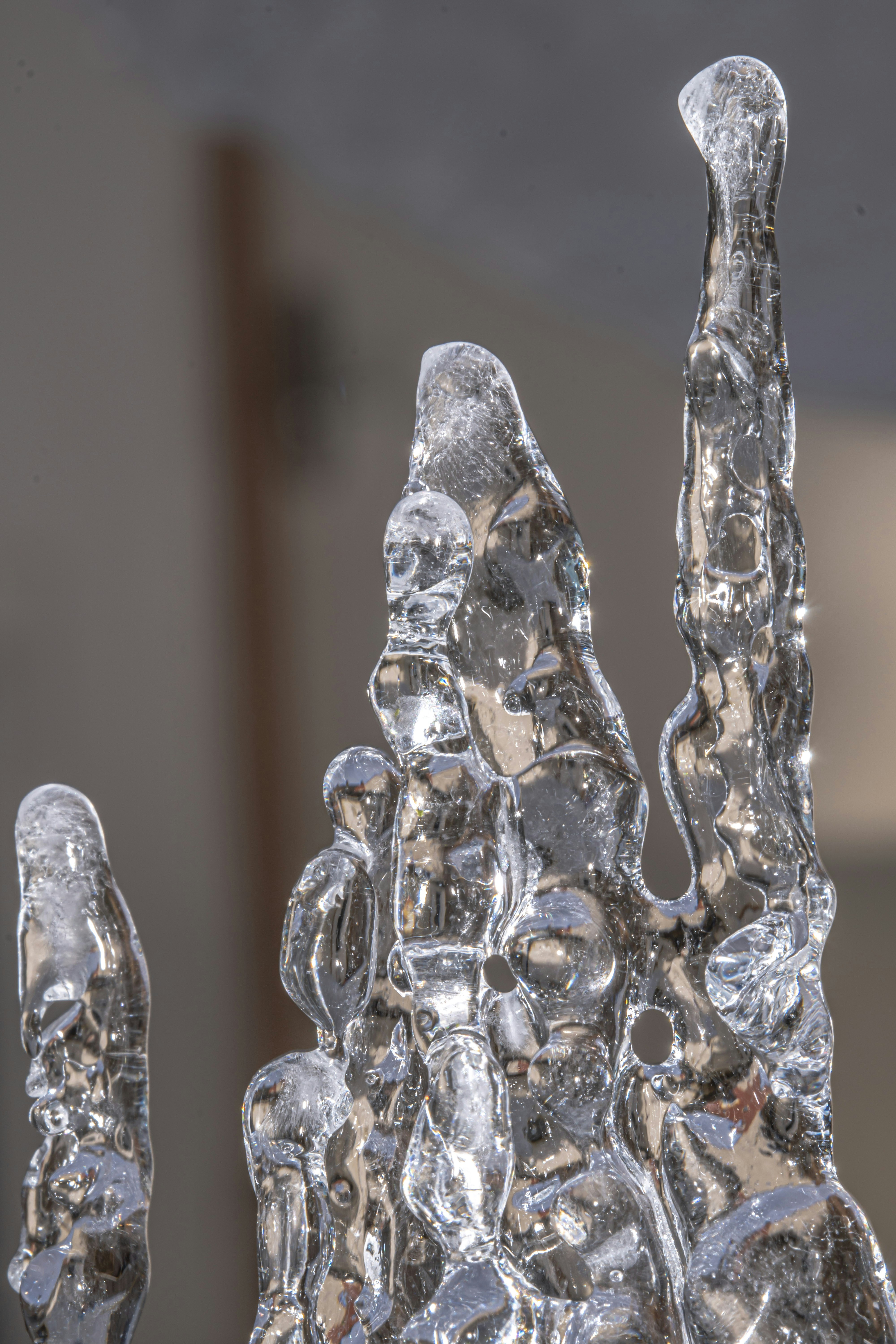 Icicle Sculpture: Close-Up of Frozen Figures Reaching upward