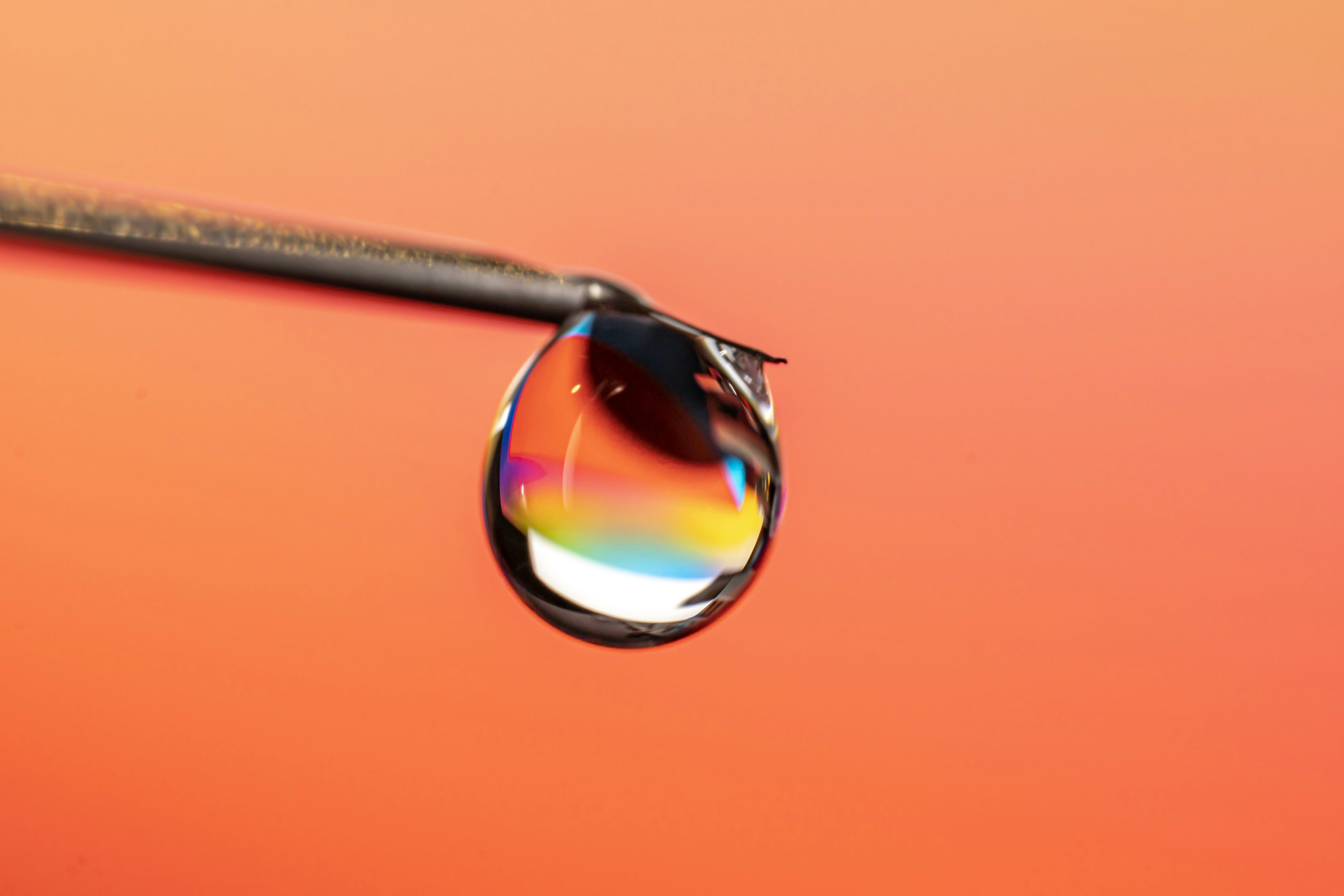 Liquid Prism: A Droplet on the Edge of a Needle