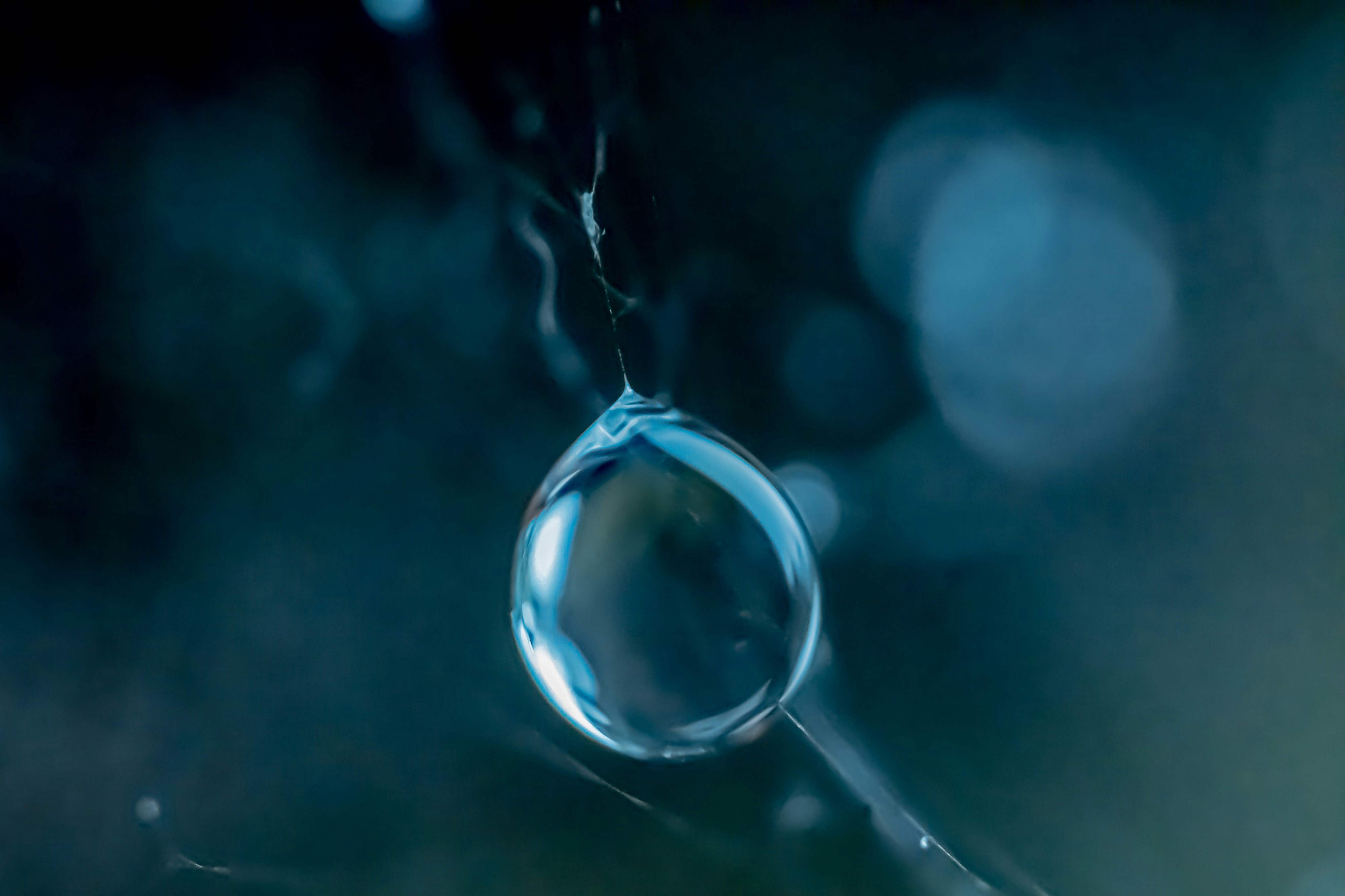 Gossamer Sphere: A Dewdrop Suspended on a Fine Web