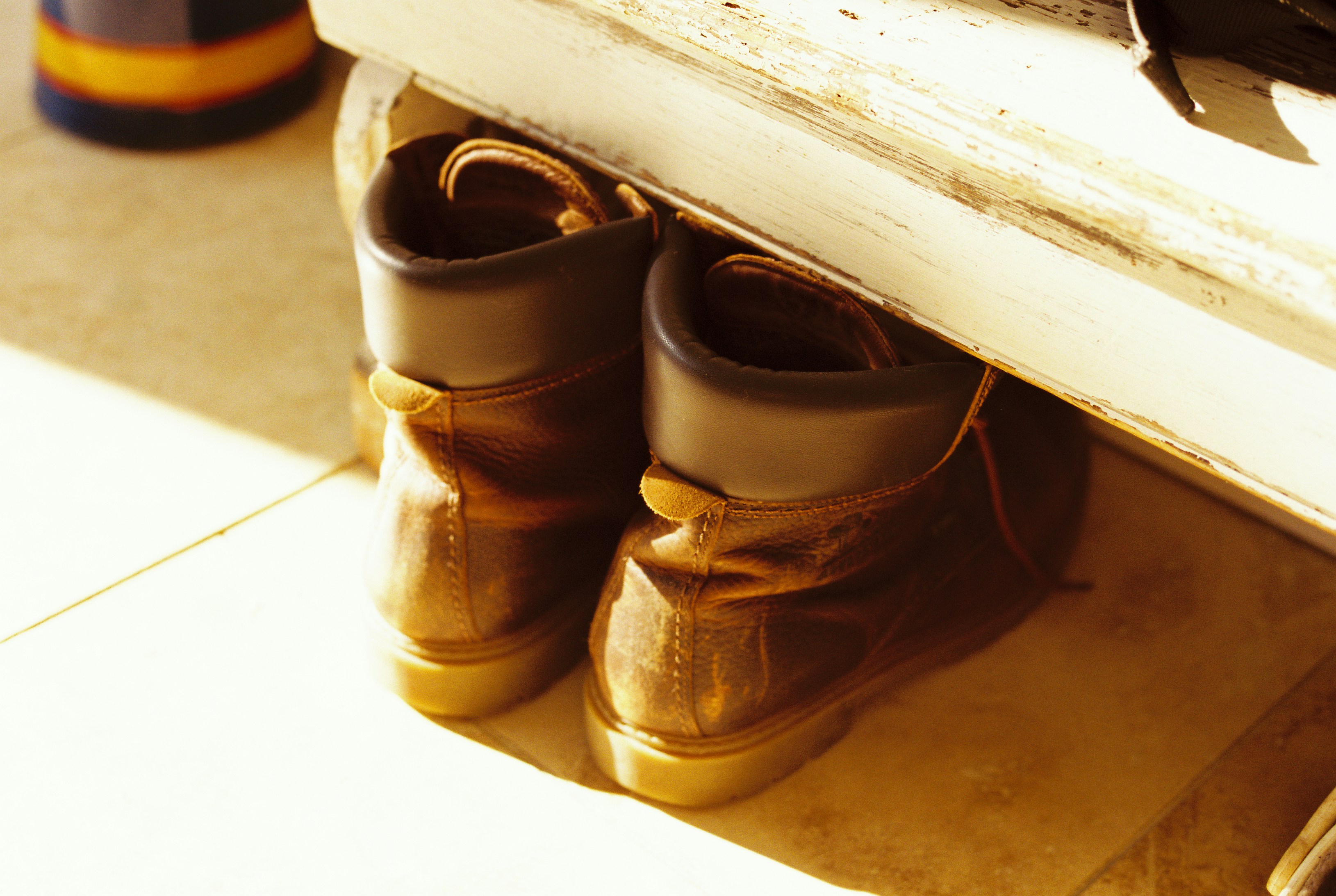 Sunlit Boots in a Quiet Porch