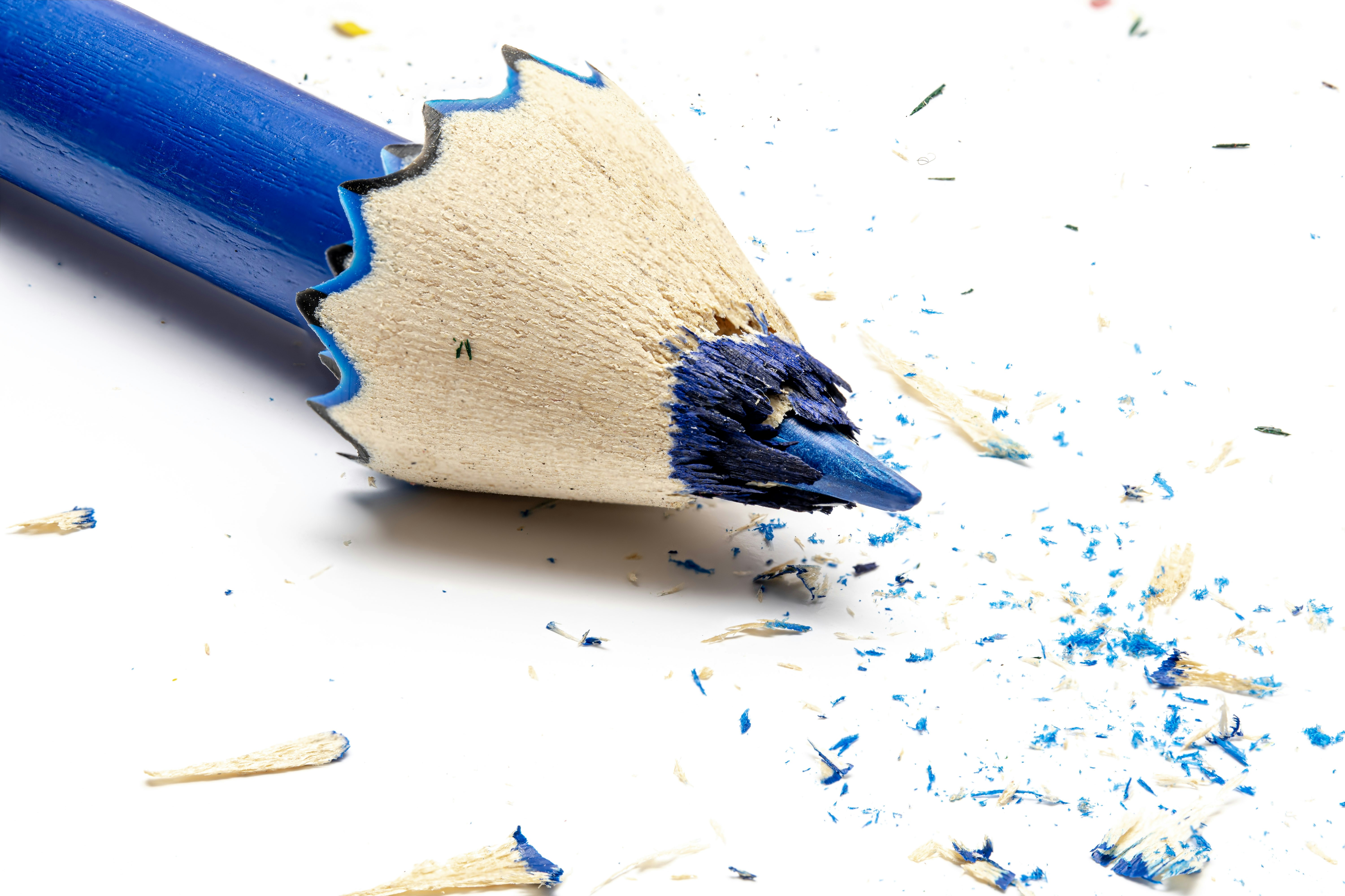 Shattered Blue: a close-up of pencils snapped and scattered shavings