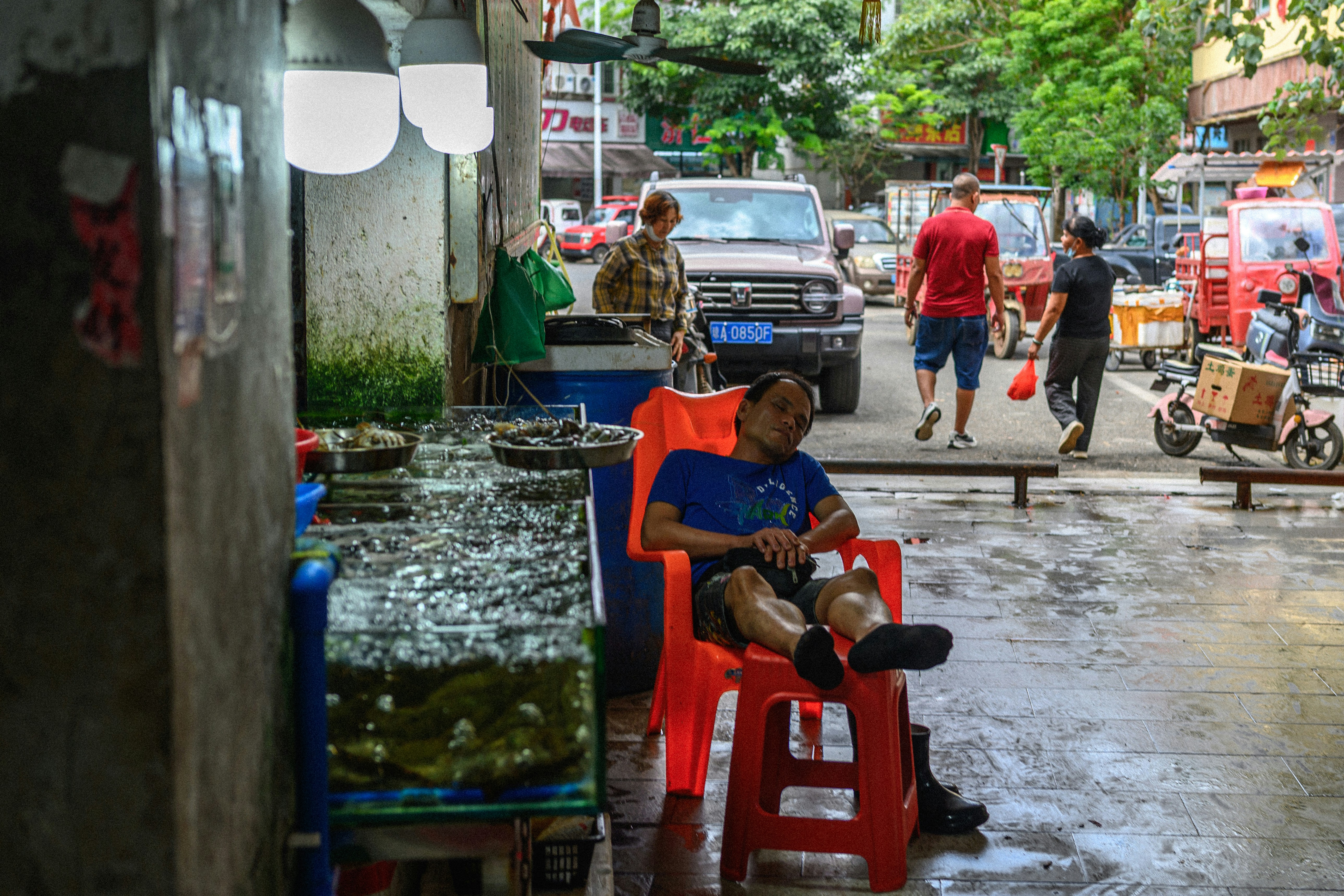 Chillin' by the Street Market: Red Chair, Quiet Observer