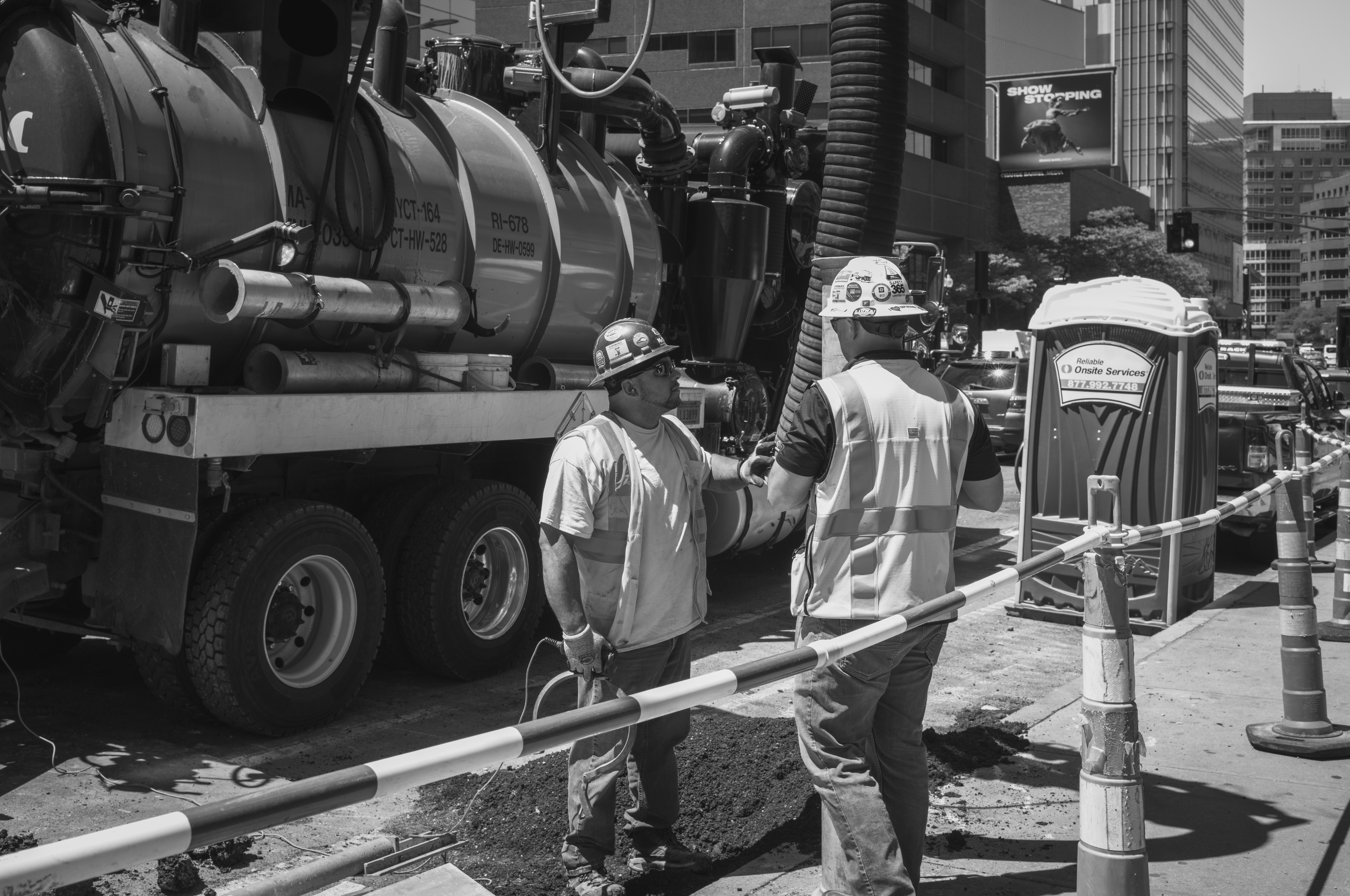 Lines of Work: Two Workers on a Quiet City Pipe Installation